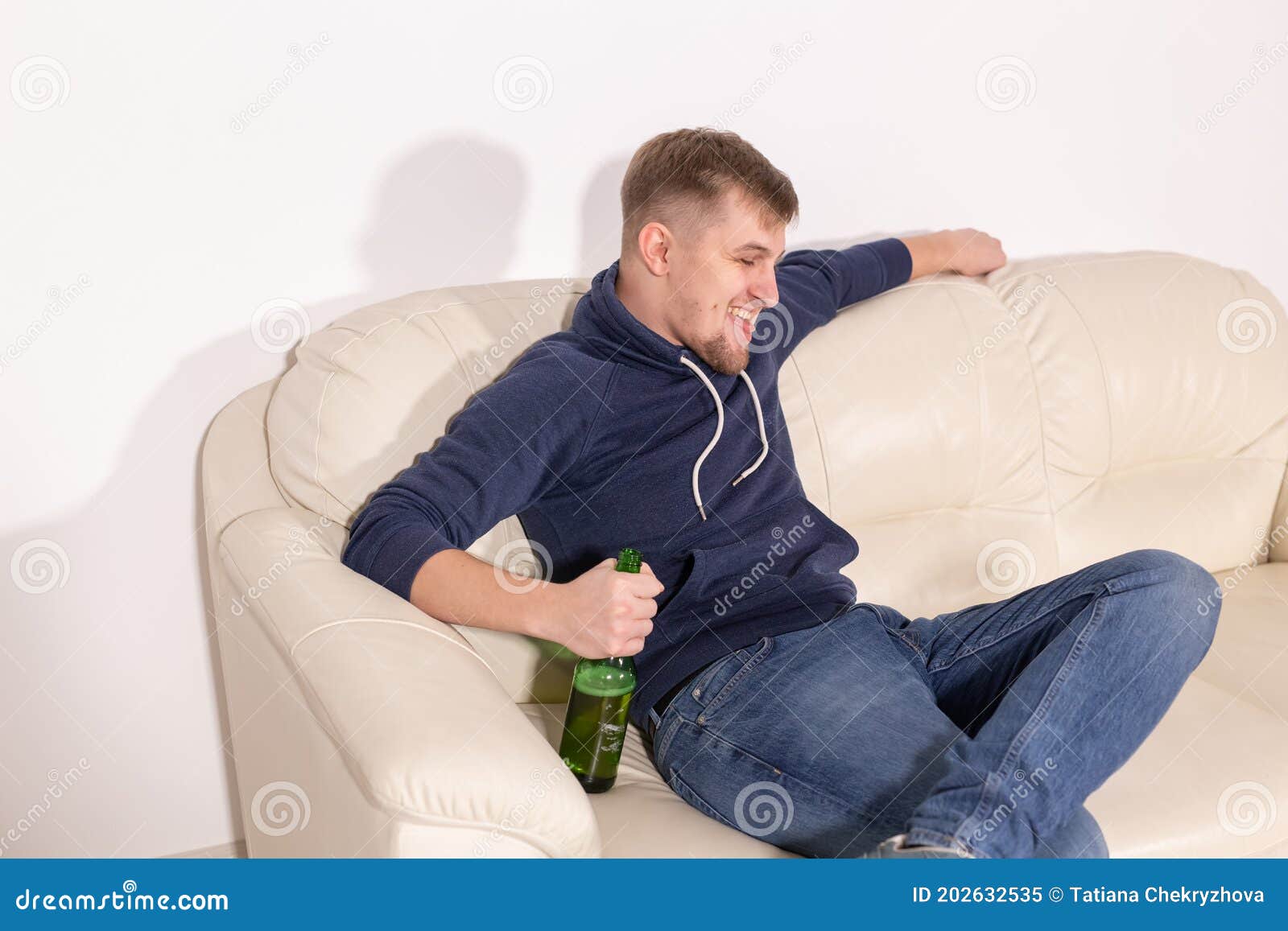 Depression and Alcoholism Concept - Aggressive Young Man Sitting on a ...