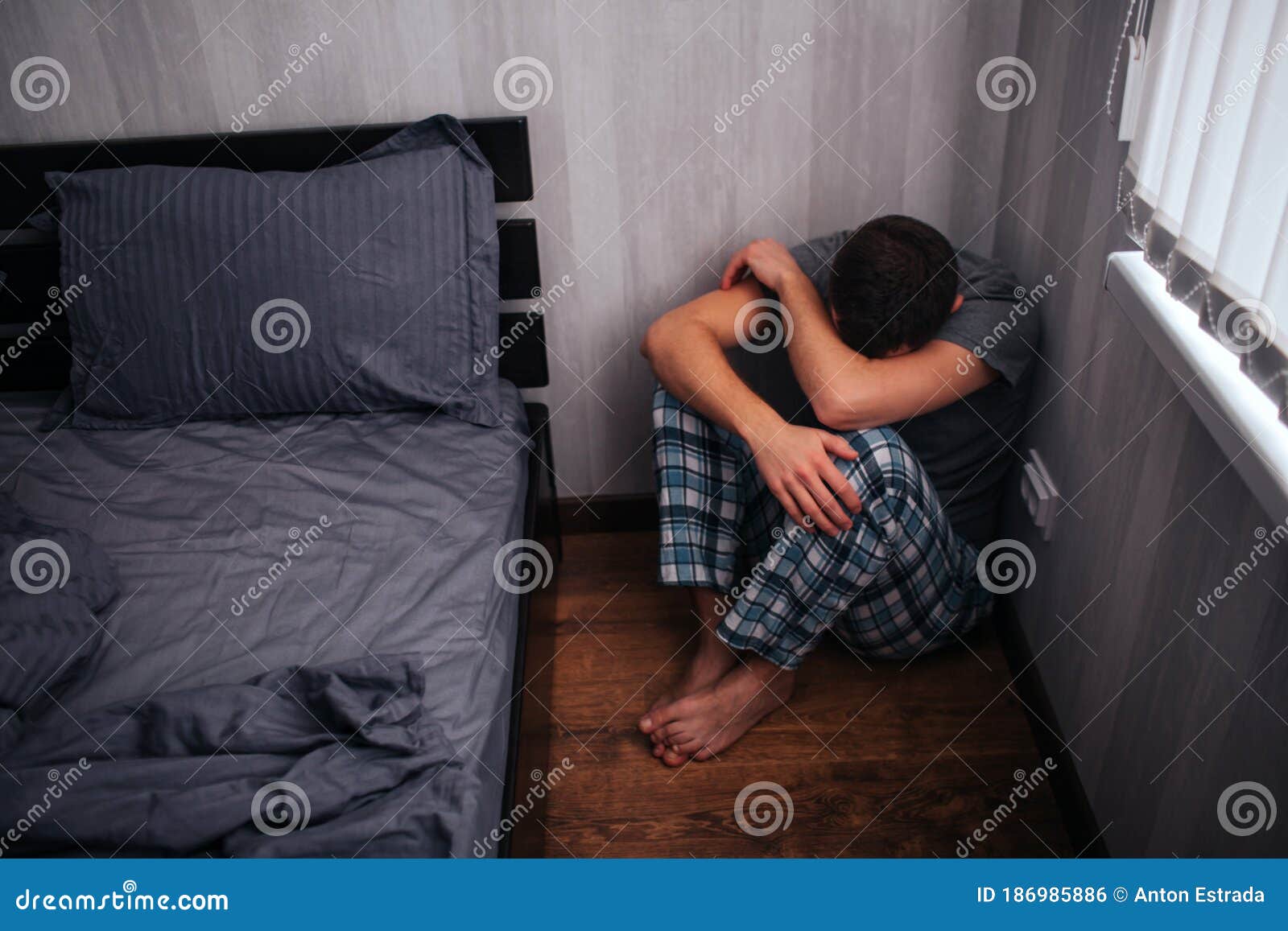 Depression, Panic Attack Concept. a Man is Sitting in a Corner Near the ...