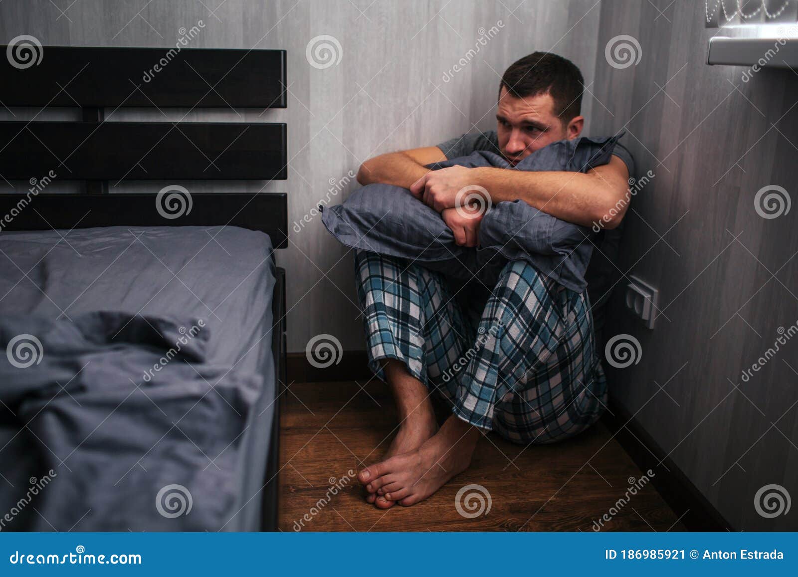 Depression, Panic Attack Concept. a Man is Sitting in a Corner Near the ...