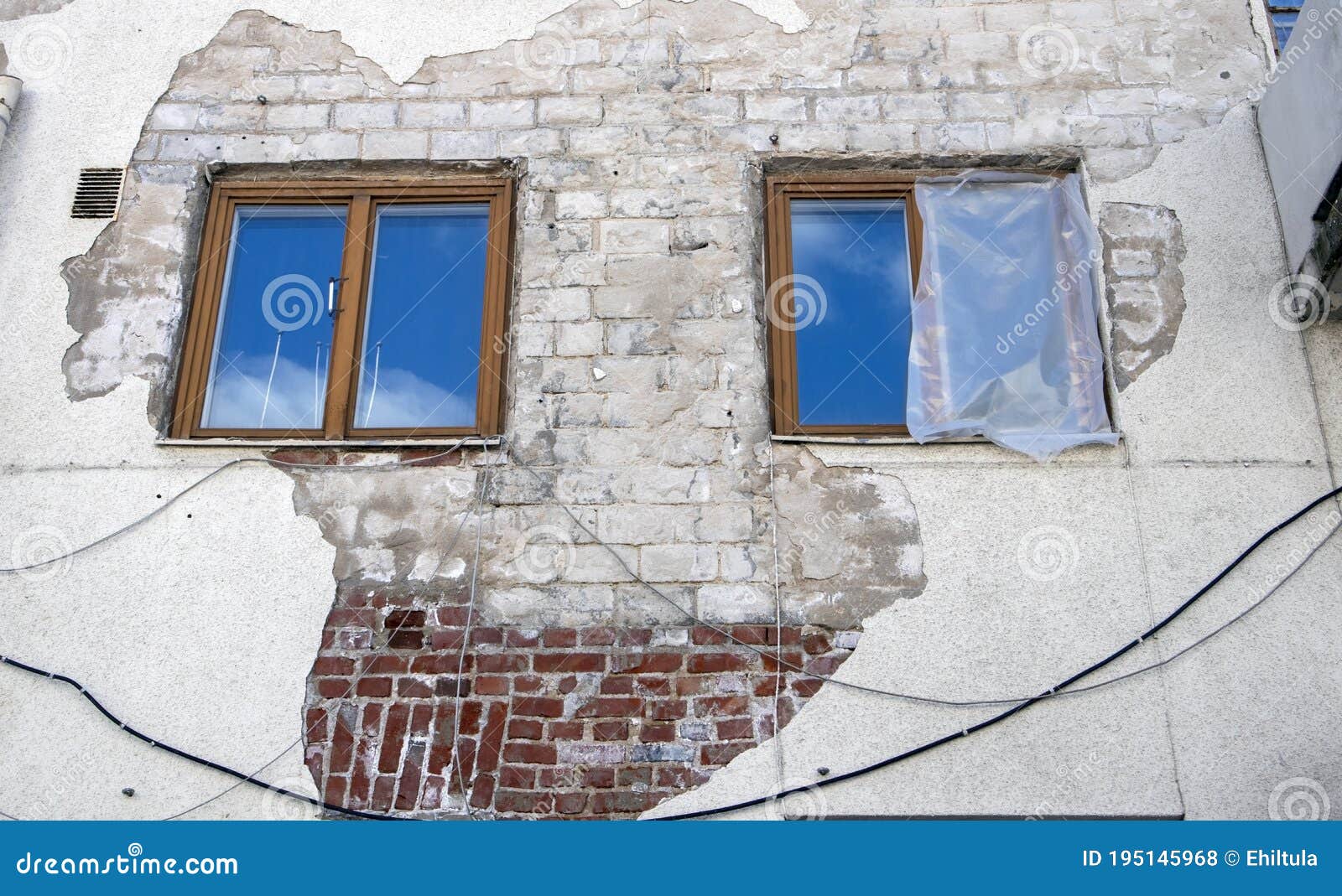 Derelict Building with Two Windows and Broken Plaster Stock Photo ...