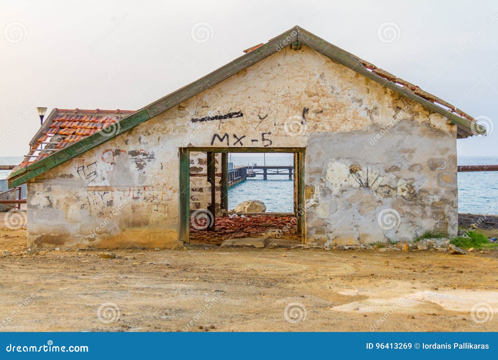 Derelict House by a Pier in Argaka Beach, Cyprus. Stock Image - Image ...