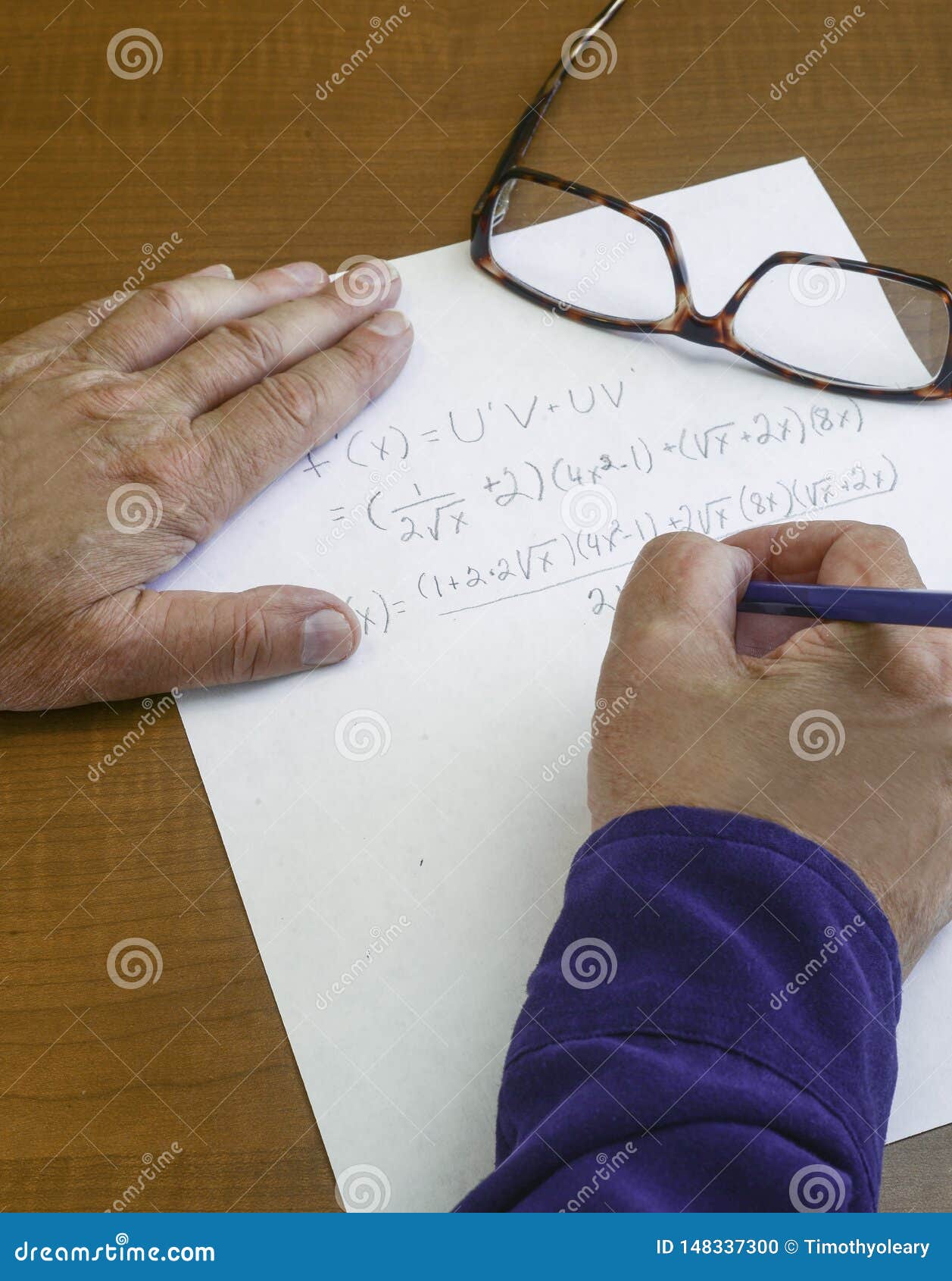 Calculus Problem Being Worked Out To Find a Solution with Paper and ...