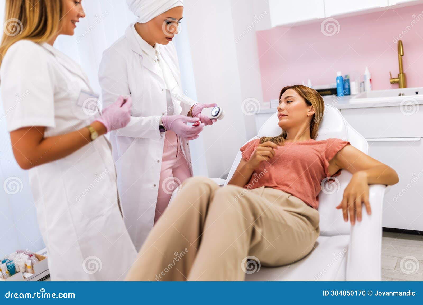 Dermatologist Examines The Moles Or Acne Of The Patient With A