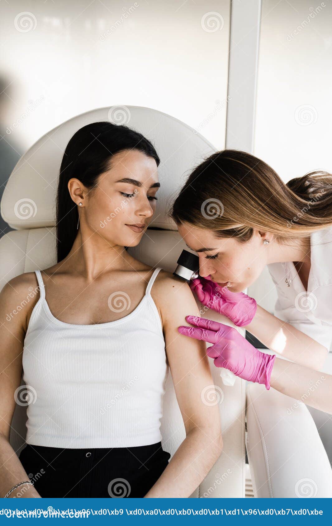 Dermatologist Examines Moles And Birthmarks Of Girl Patient Using