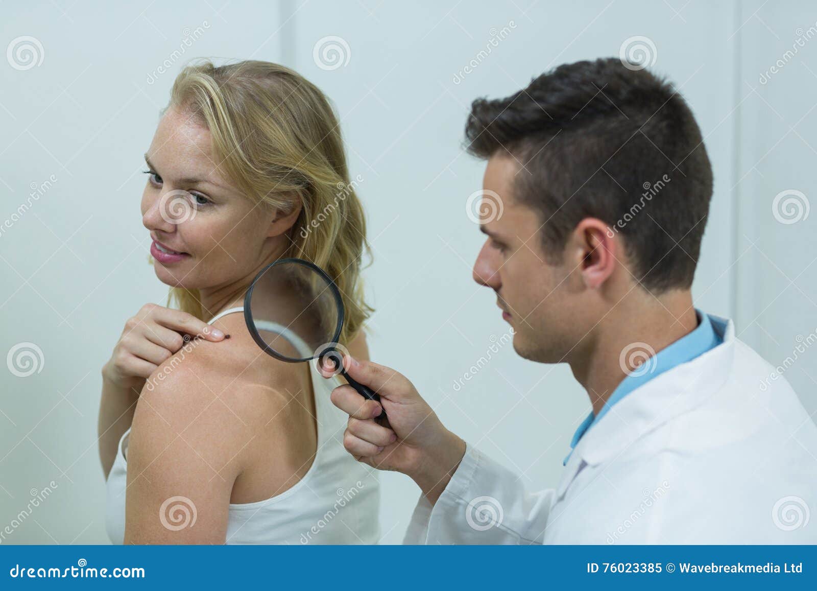 Dermatologist Examining Mole with Magnifying Glass Stock Image - Image ...