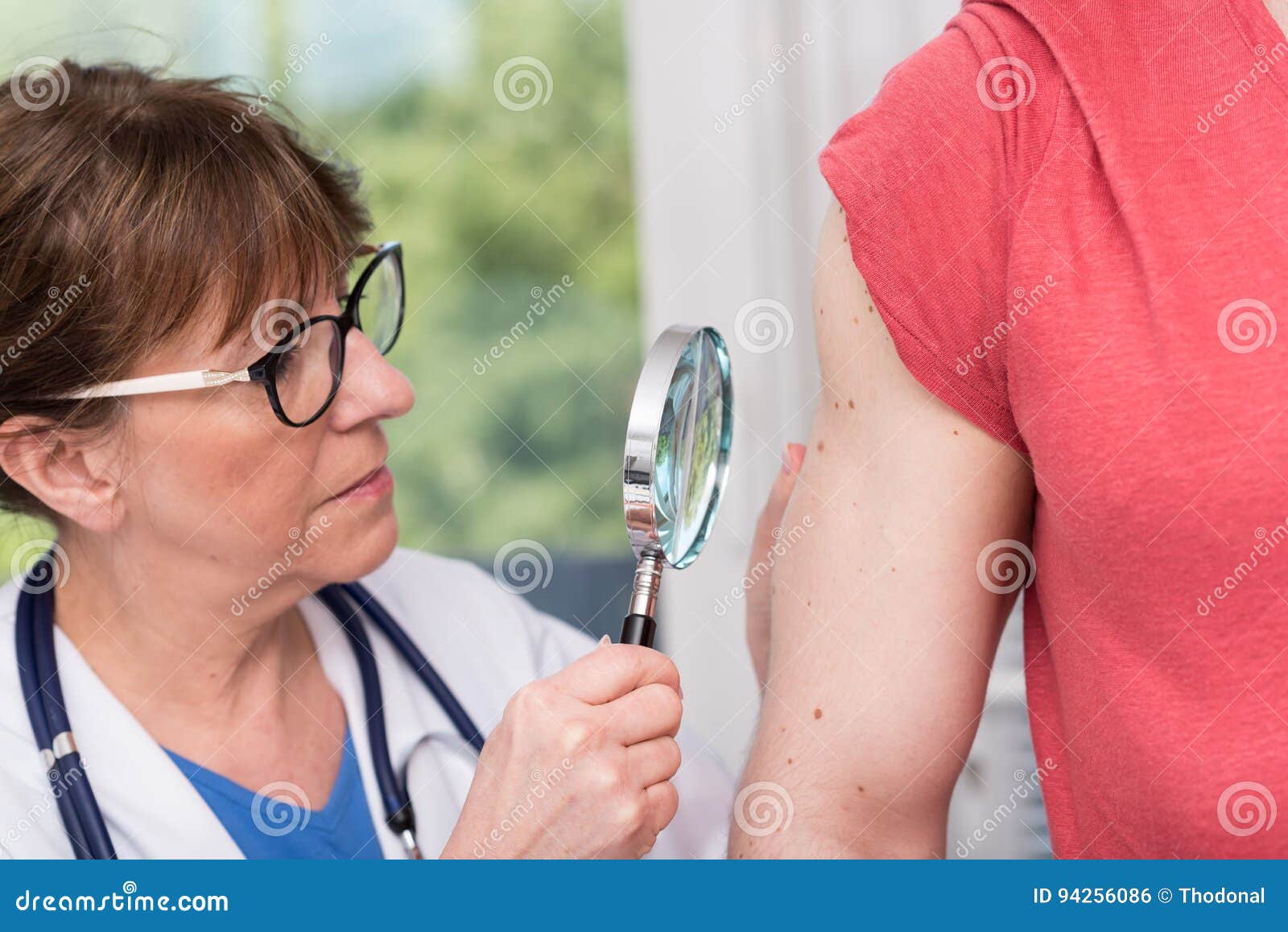 Dermatologist Examining the Skin of a Patient Stock Photo - Image of ...