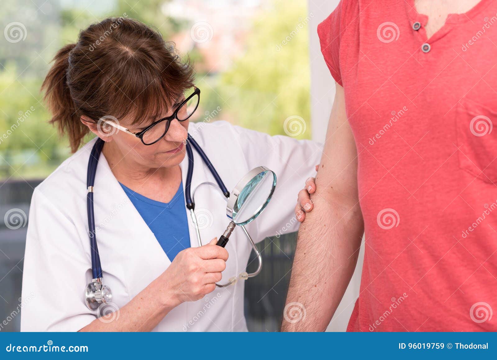 Dermatologist Examining the Skin of a Patient Stock Image - Image of ...