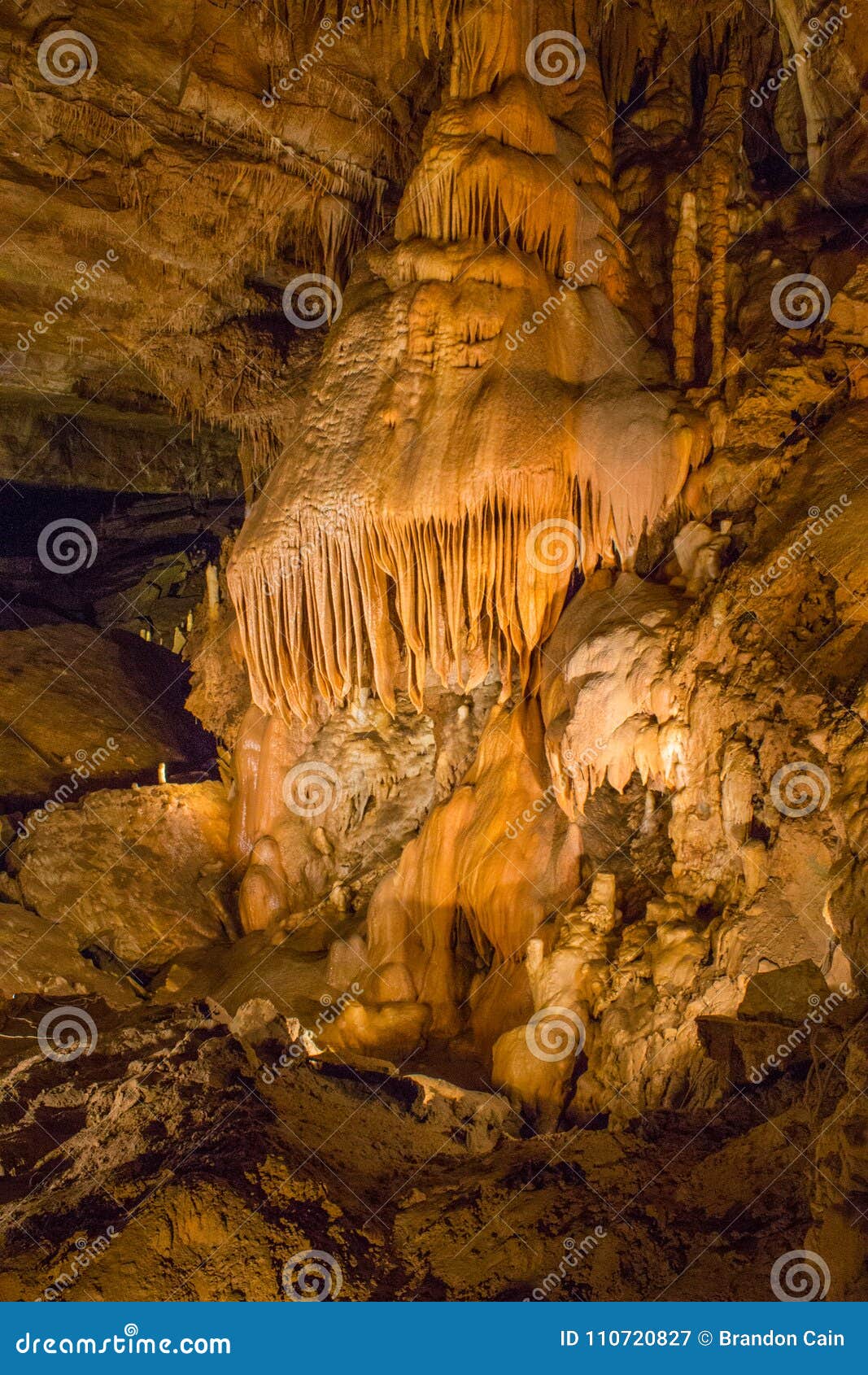 Descending cave formation stock image. Image of illuminated - 110720827