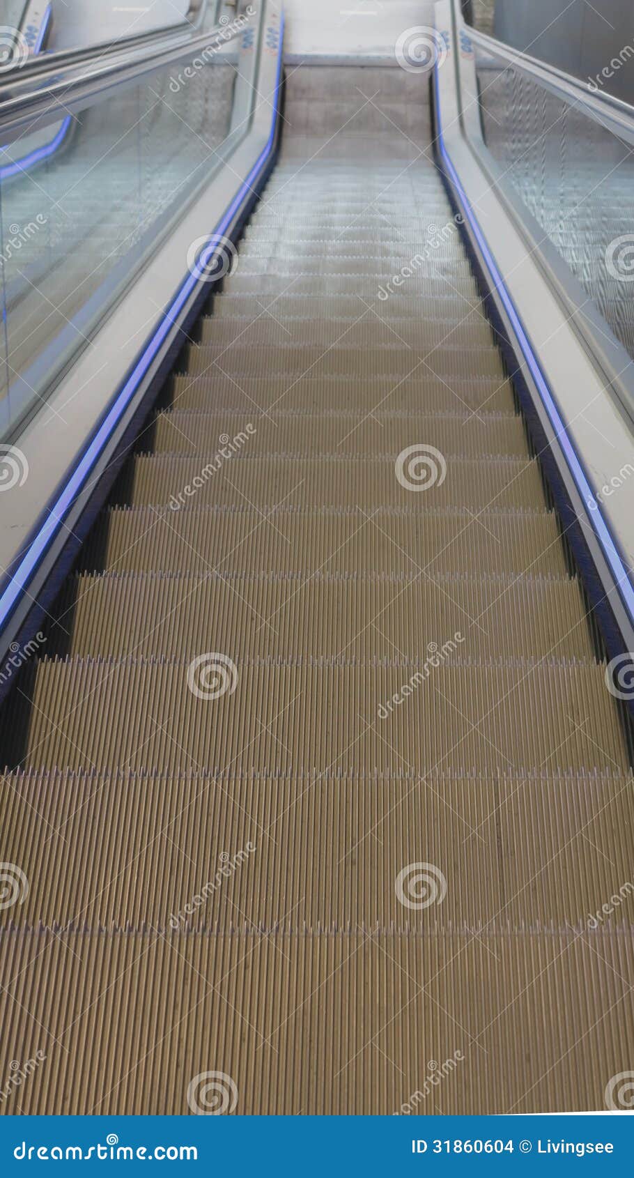 Descent On The Escalator In The Metro. Light Boxes Along The Tunnel ...