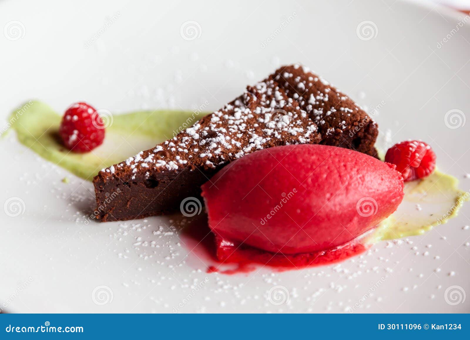 Chocolate Cake with Raspberry Sherbet and Pistachio Cream Stock Photo ...