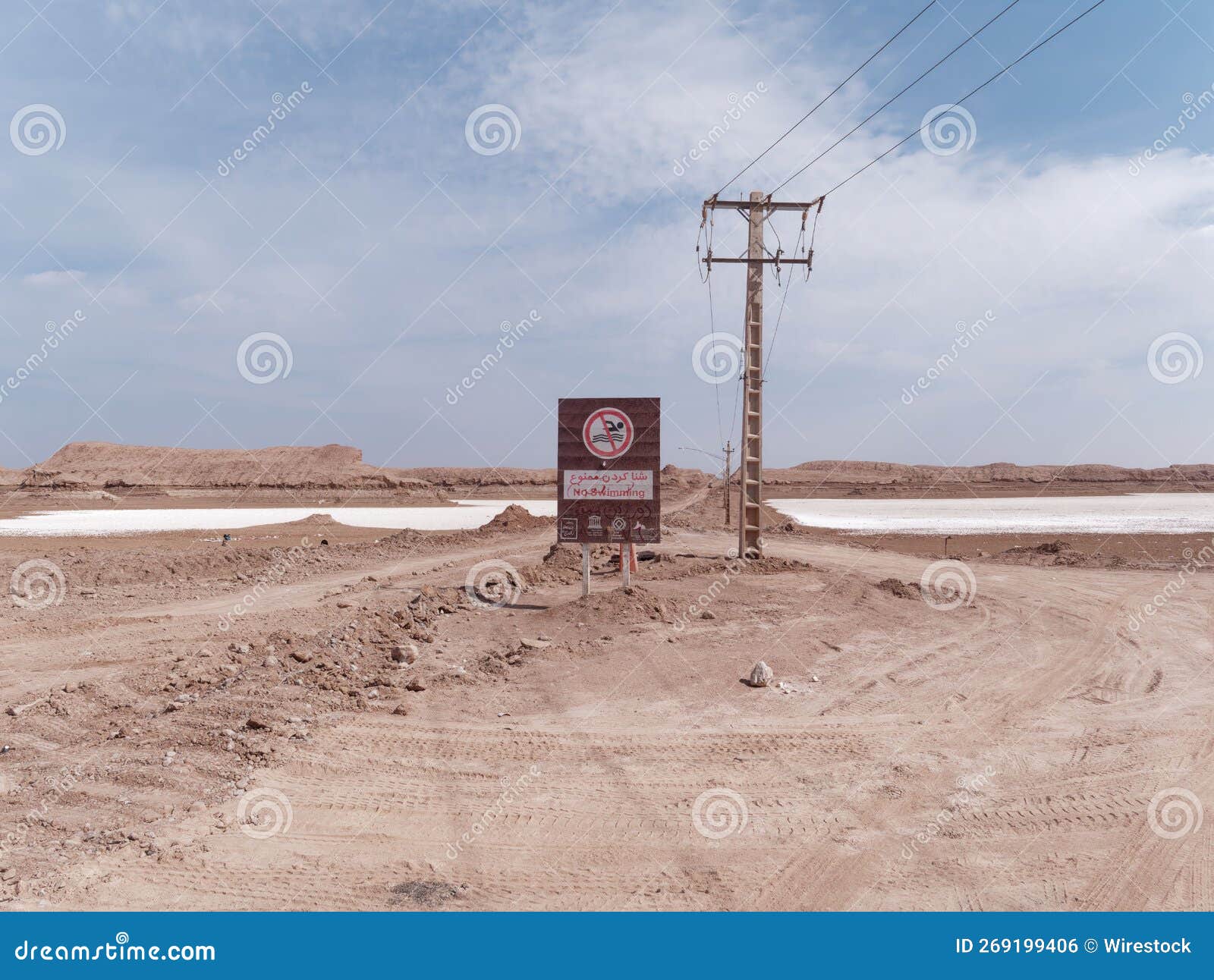 Desert Landscape Featuring an Empty Dirt Road with a Signpost in the ...