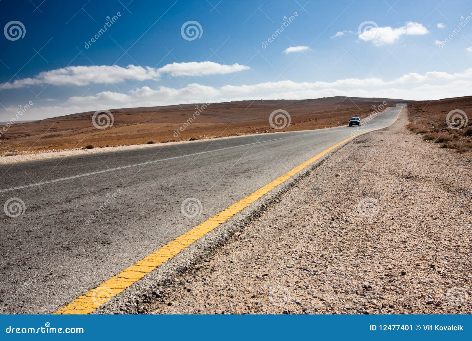 Desert road with blue car stock image. Image of highway - 12477401