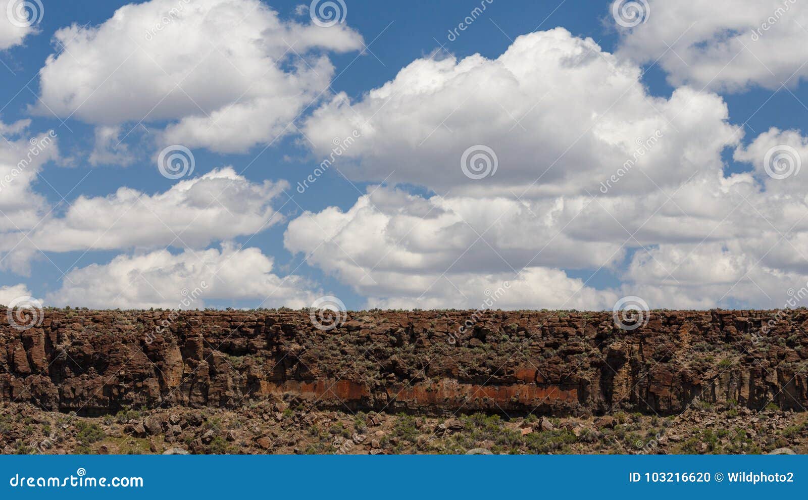 Desert Rock Cliff and Clouds Stock Photo - Image of rocks, shadows ...