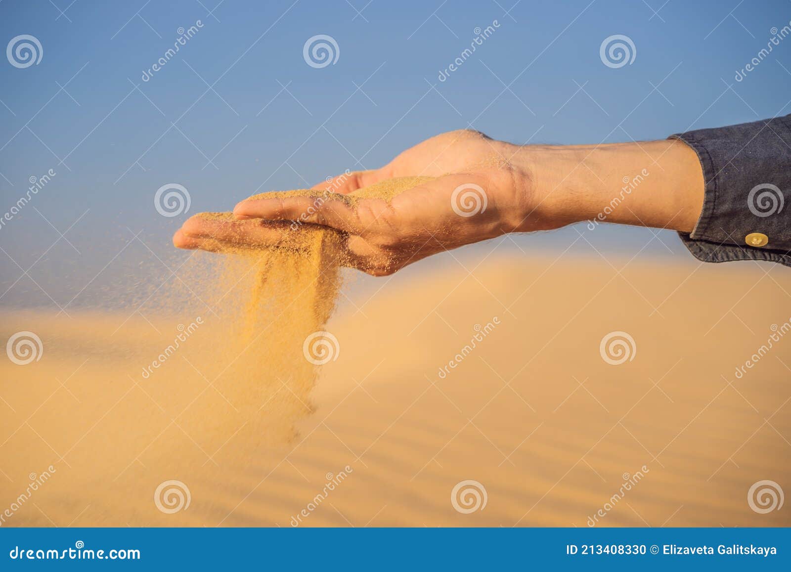 Desert, Sand Puffs through the Fingers of a Mans Hand Stock Photo ...