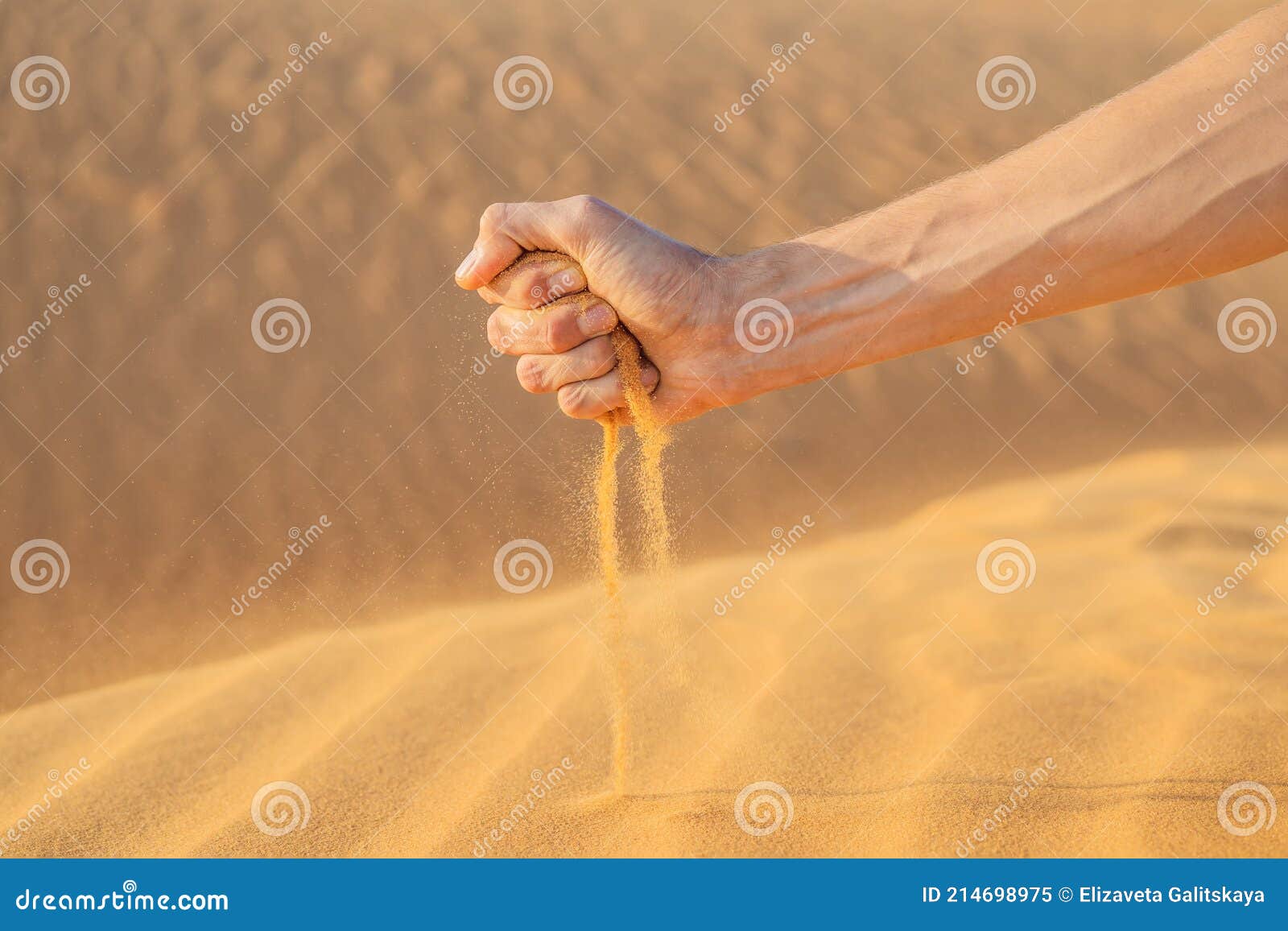 Desert, Sand Puffs through the Fingers of a Mans Hand Stock Image ...