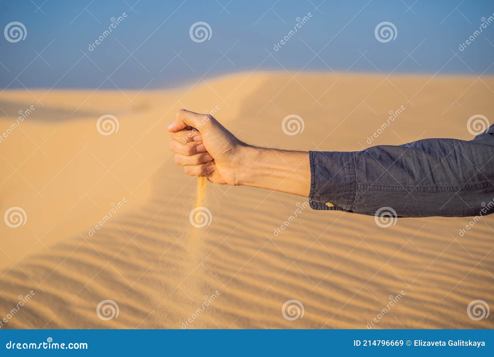 Desert, Sand Puffs through the Fingers of a Mans Hand Stock Image ...