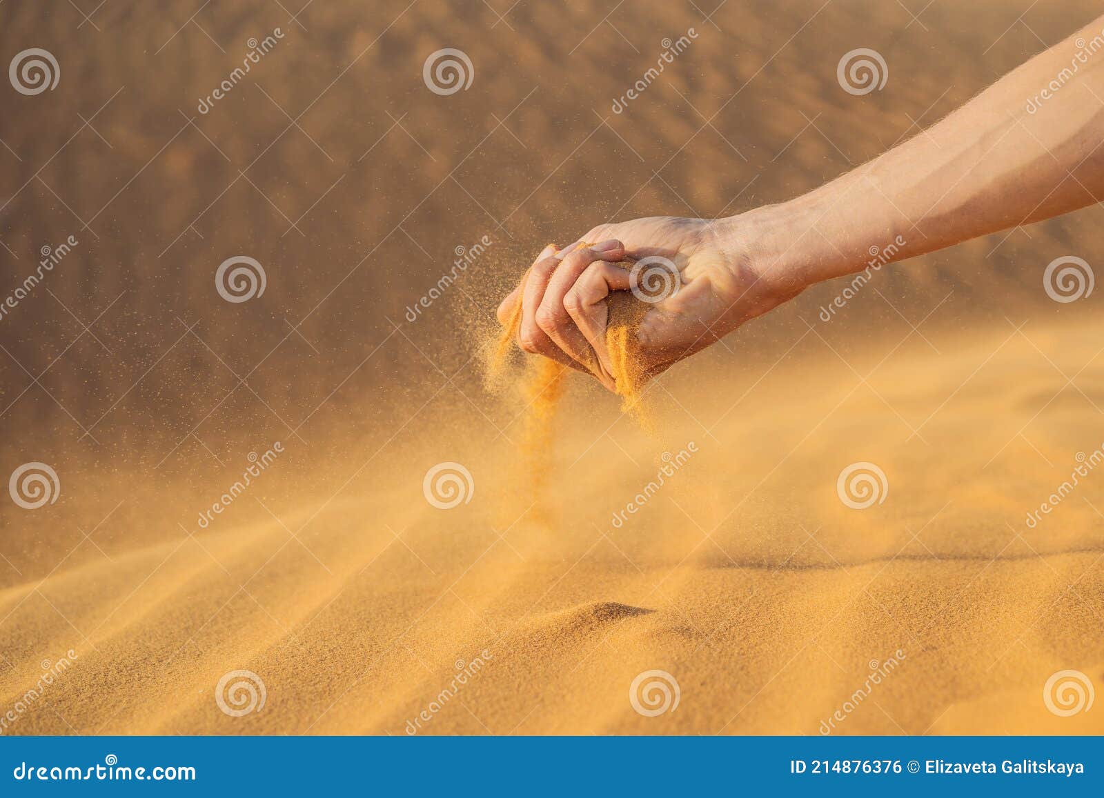 Desert, Sand Puffs through the Fingers of a Mans Hand Stock Photo ...