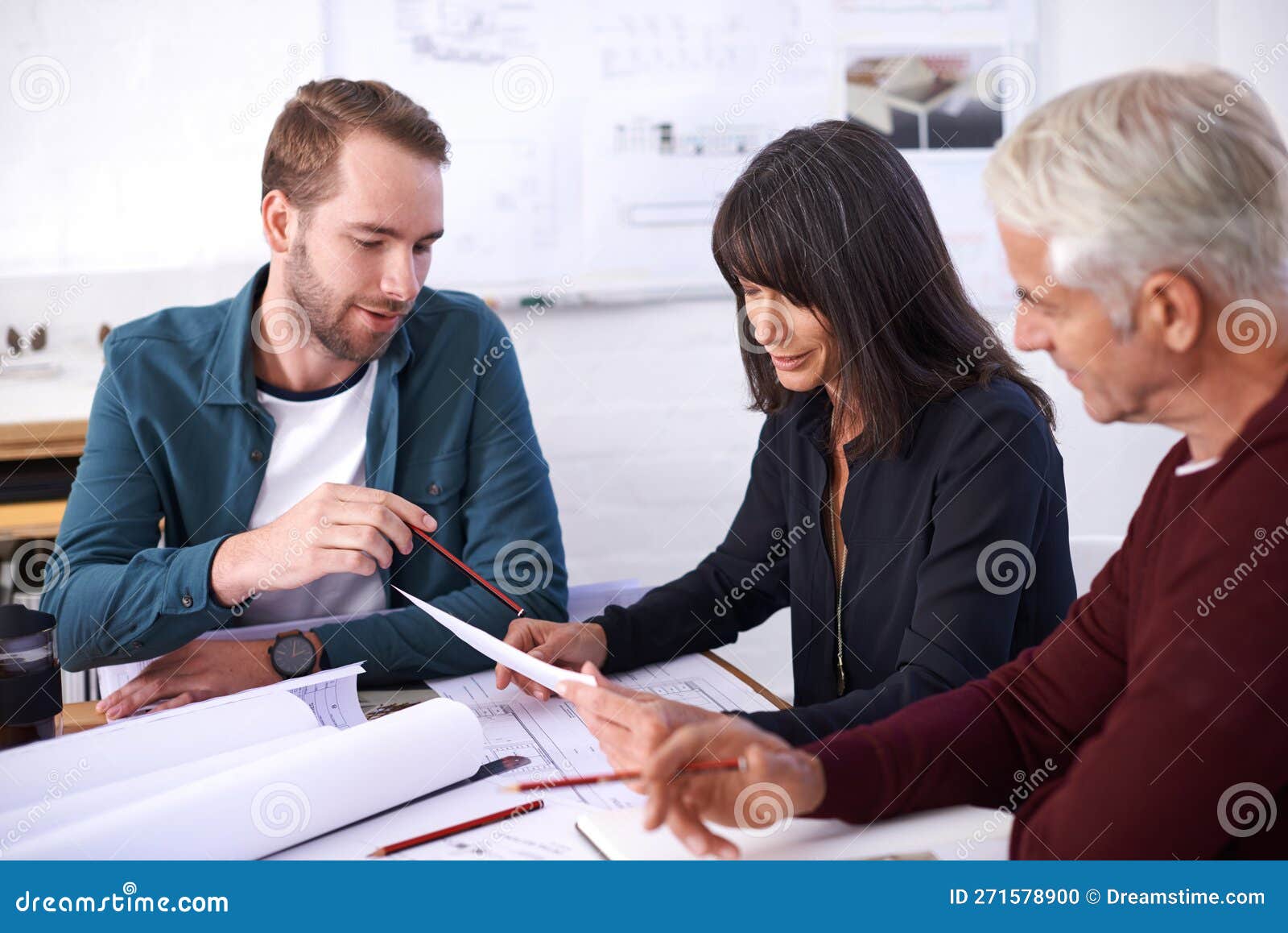 Design Minds at Work. a Team of Architects Working Together on Building ...