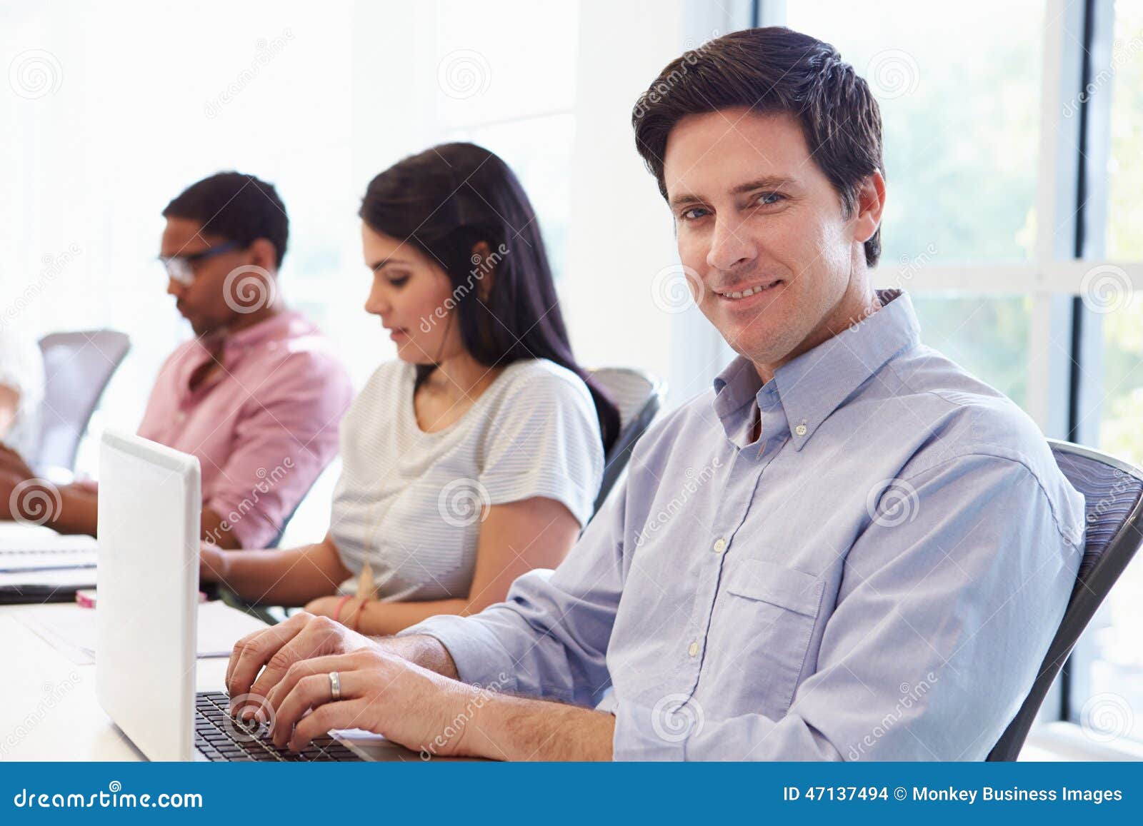 Design Team Collaborating on Project Together Stock Photo - Image of ...