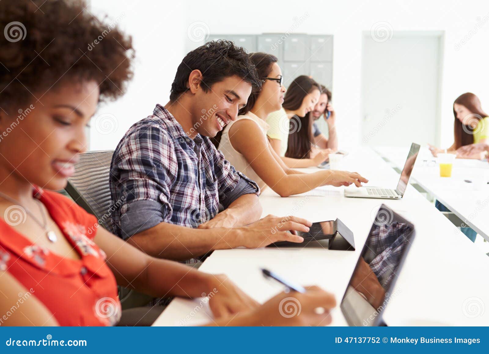 Design Team Collaborating on Project Together Stock Photo - Image of ...