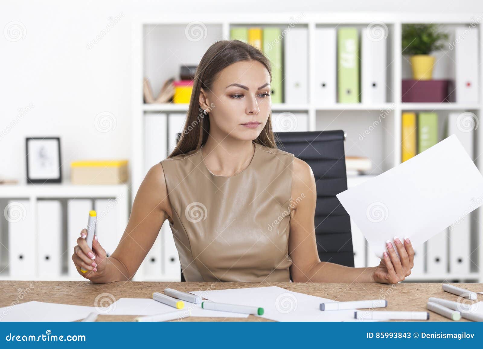 Designer in beige at work stock image. Image of hardworking - 85993843