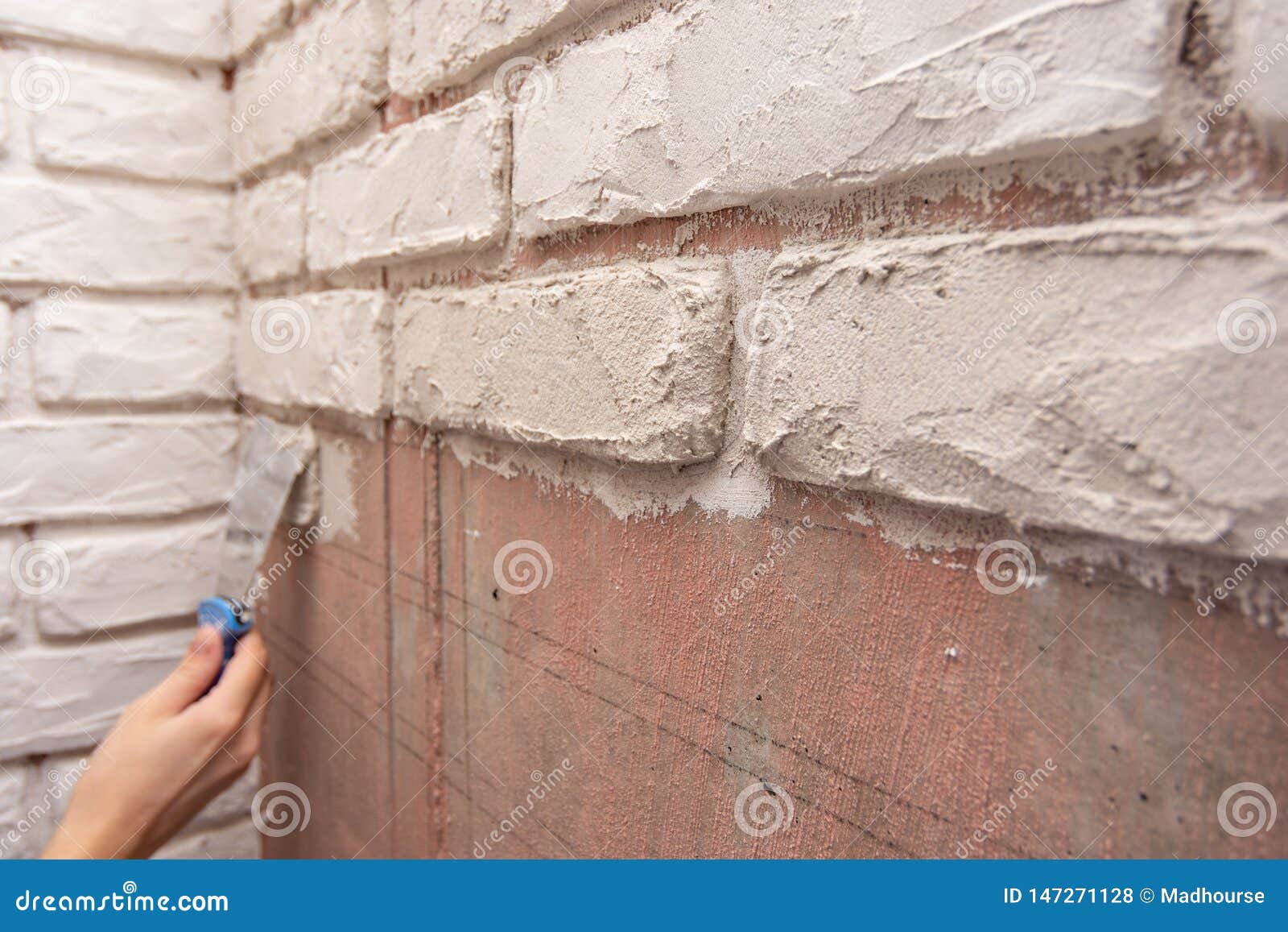 Designer Bricks with a Spatula on the Wall Stock Photo - Image of plan ...