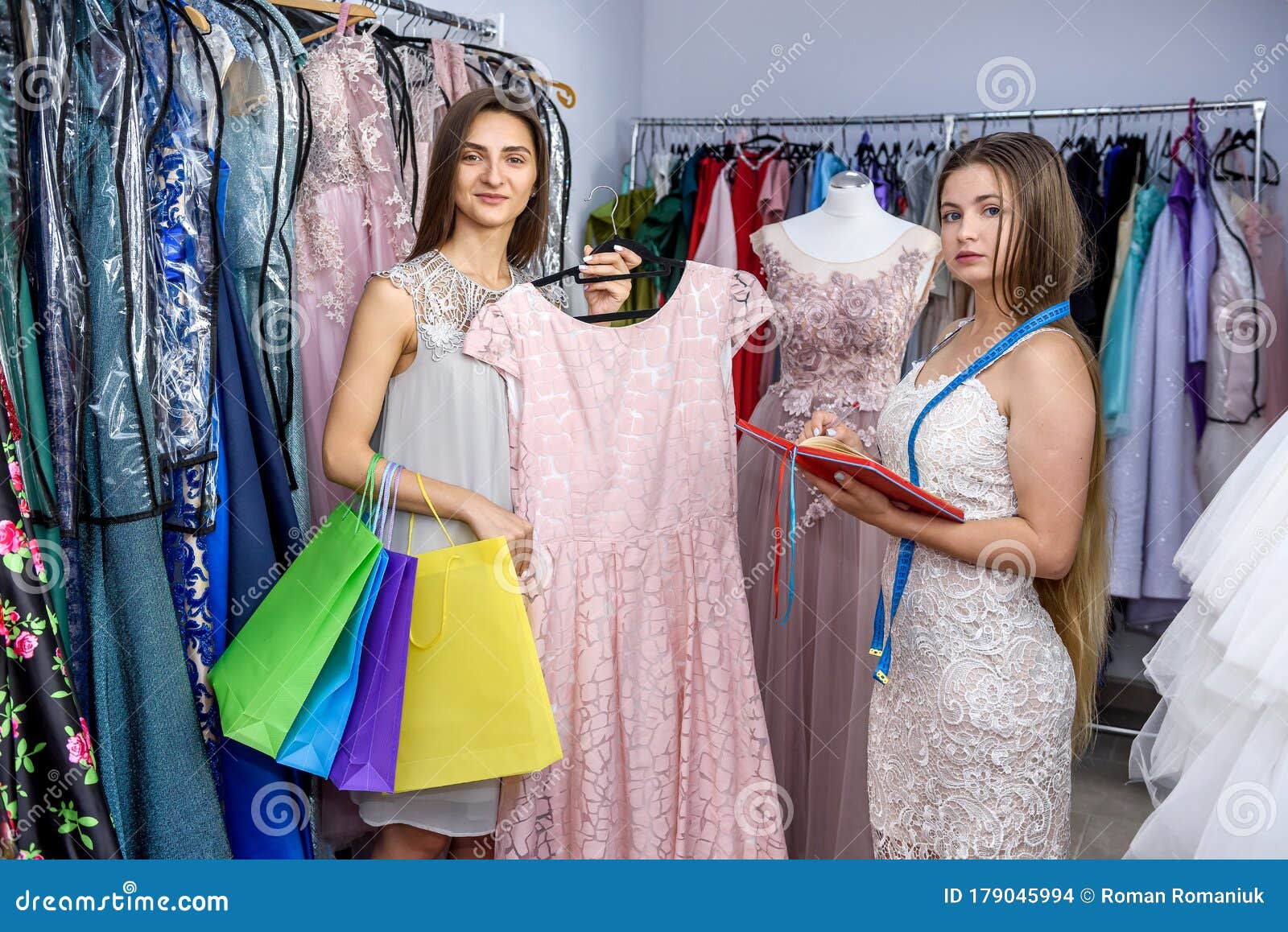 Designer and Customer in Garment Store with Dress Stock Photo - Image ...