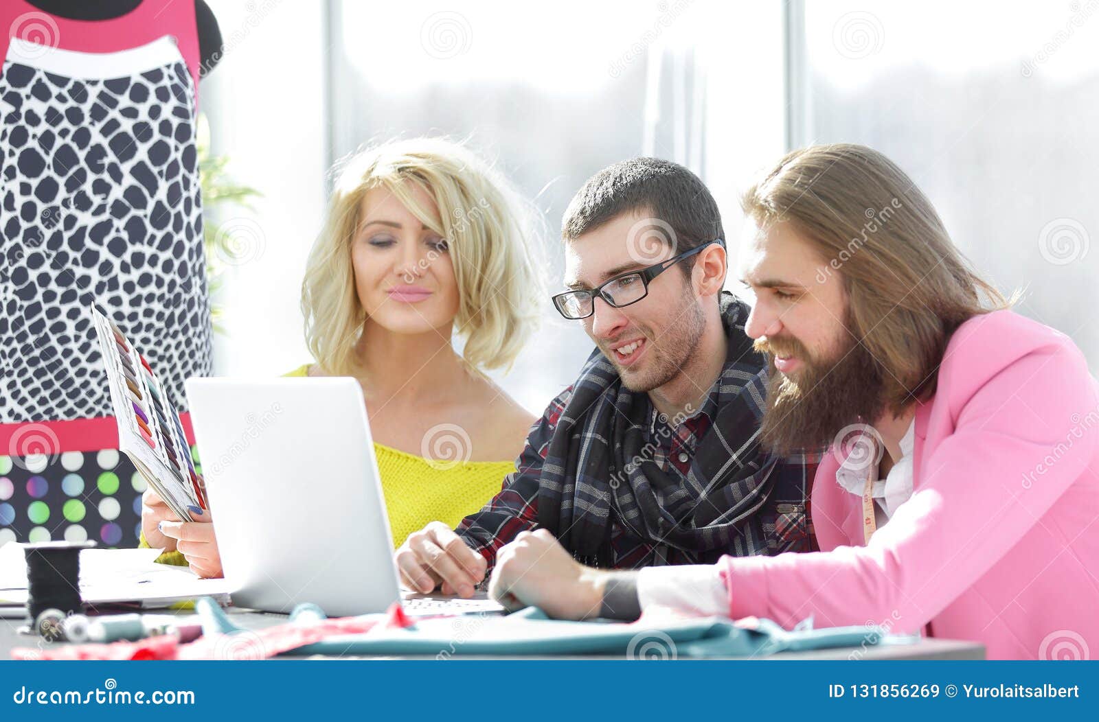 Designer Group Works on a Laptop in a Creative Office Stock Image ...
