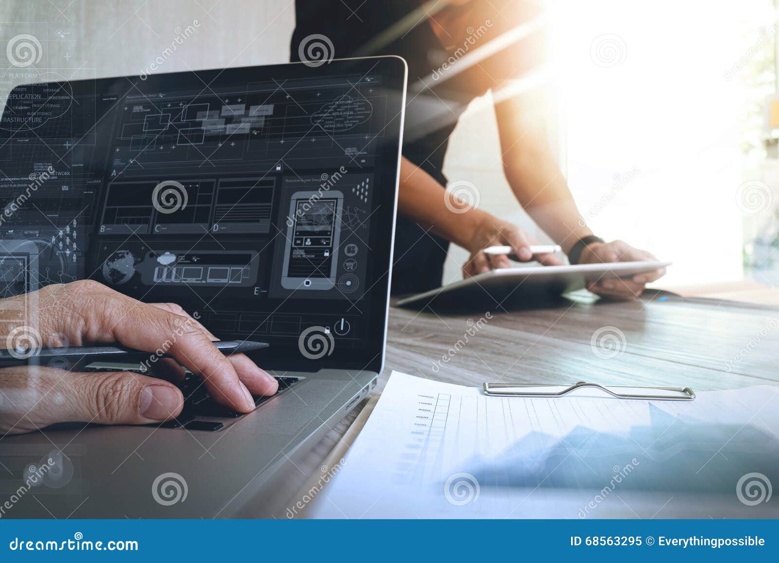 Designer Hand Working with Digital Tablet Computer and Smart Phone on ...