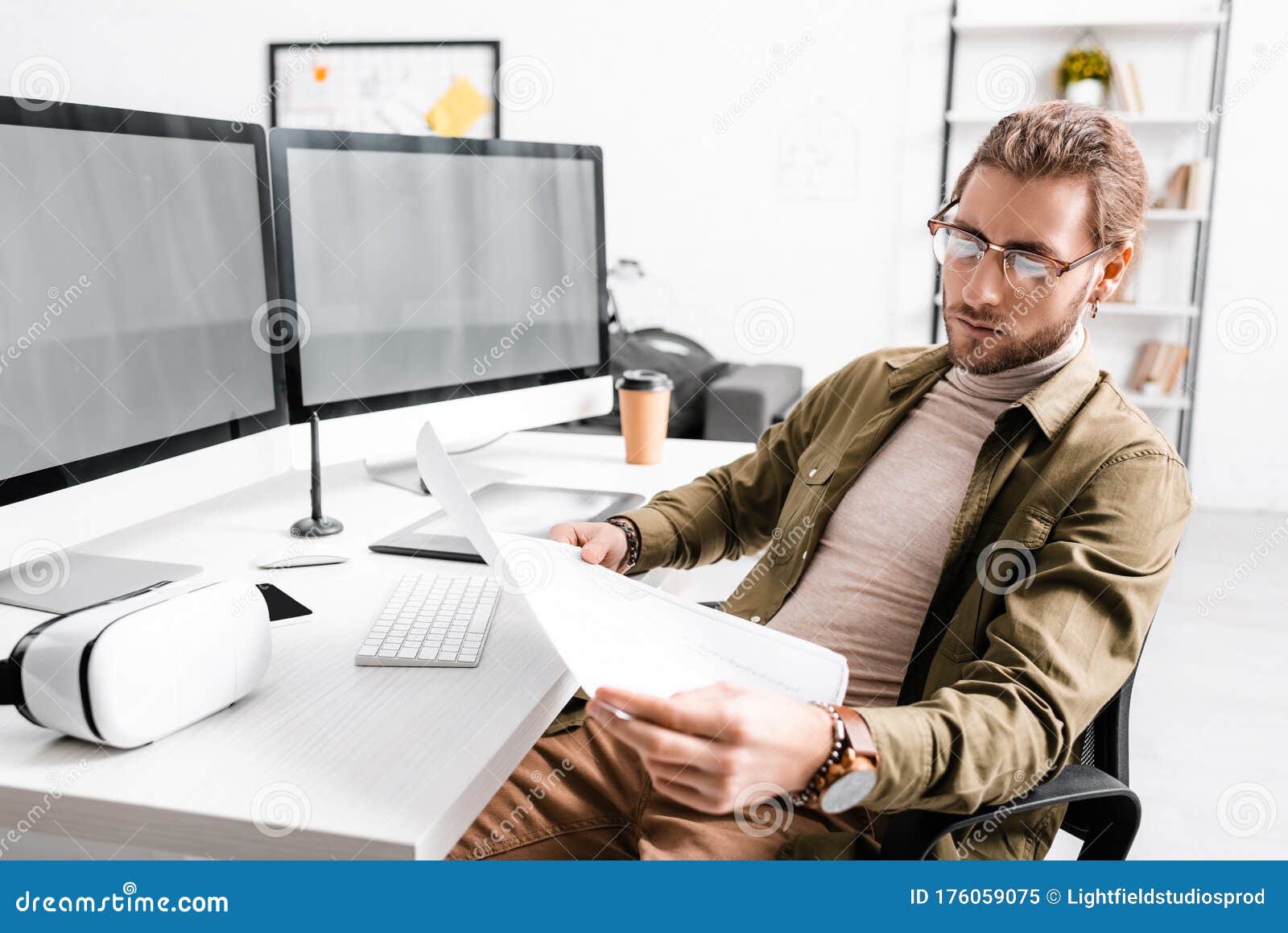 Designer Looking at Blueprint while Rendering Stock Image - Image of ...