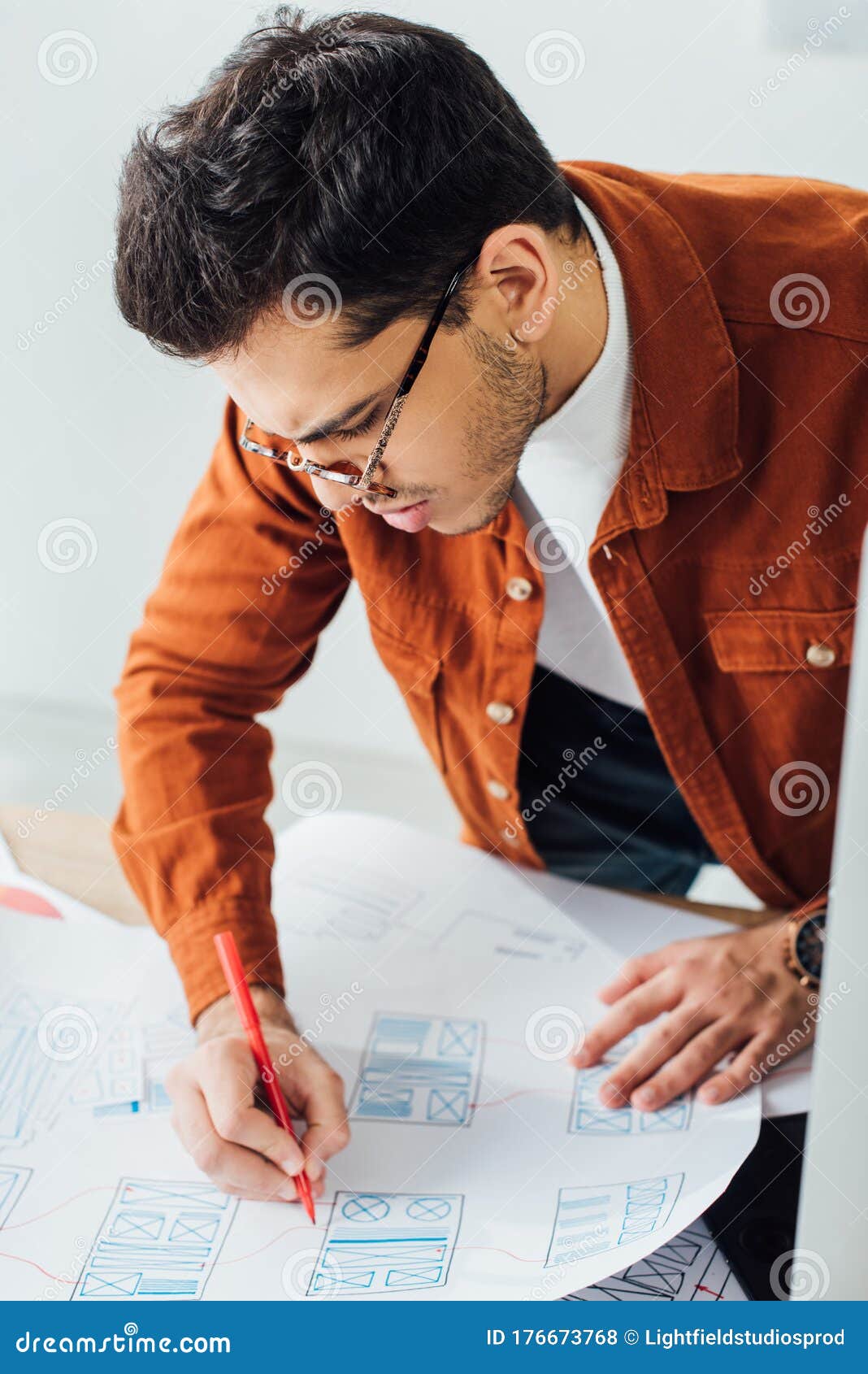 Designer with Marker Creative User Experience Design of Website on ...