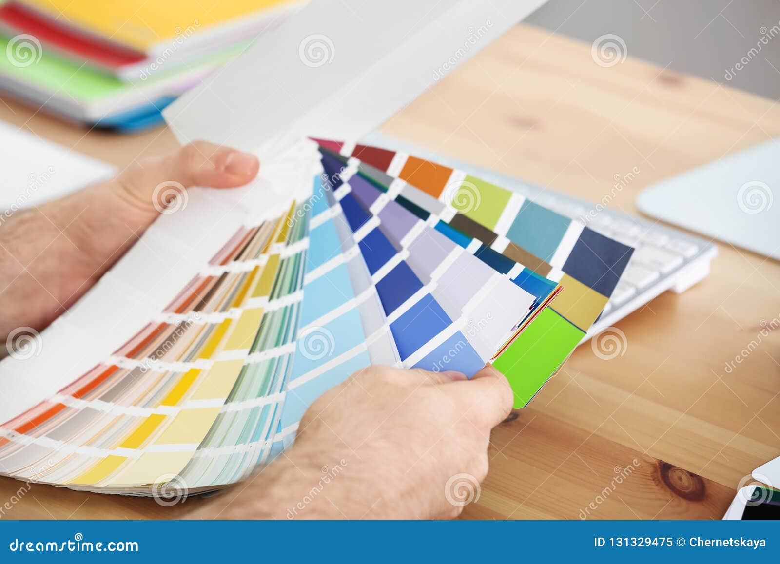 Designer with Paint Color Palette Samples at Table Stock Image - Image ...