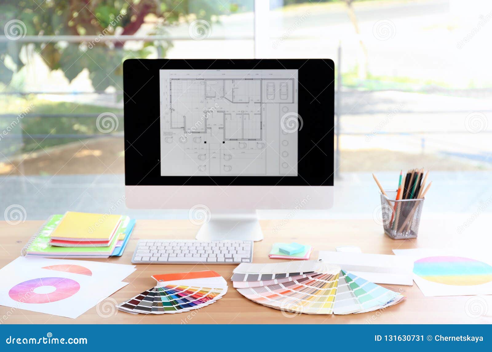 Designer`s Workplace with Computer and Paint Color Palette Samples ...