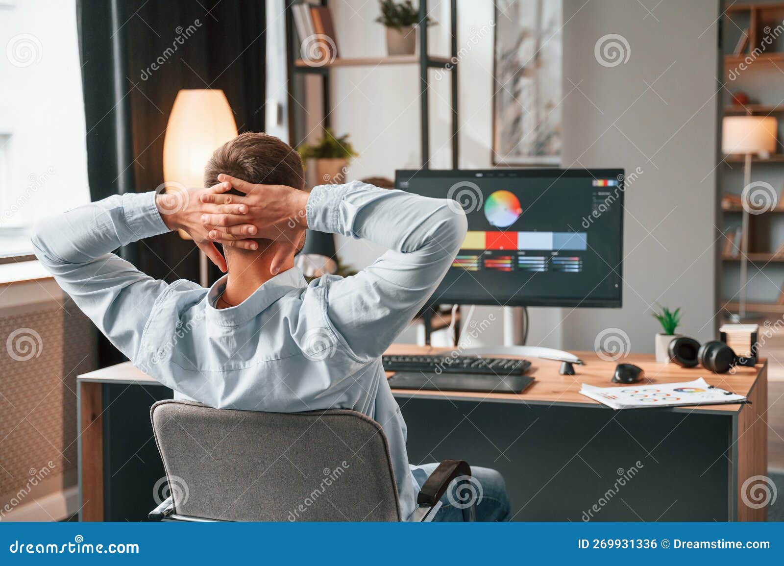 Designer is Sitting by the Computer and Using Graphics Tablet with ...