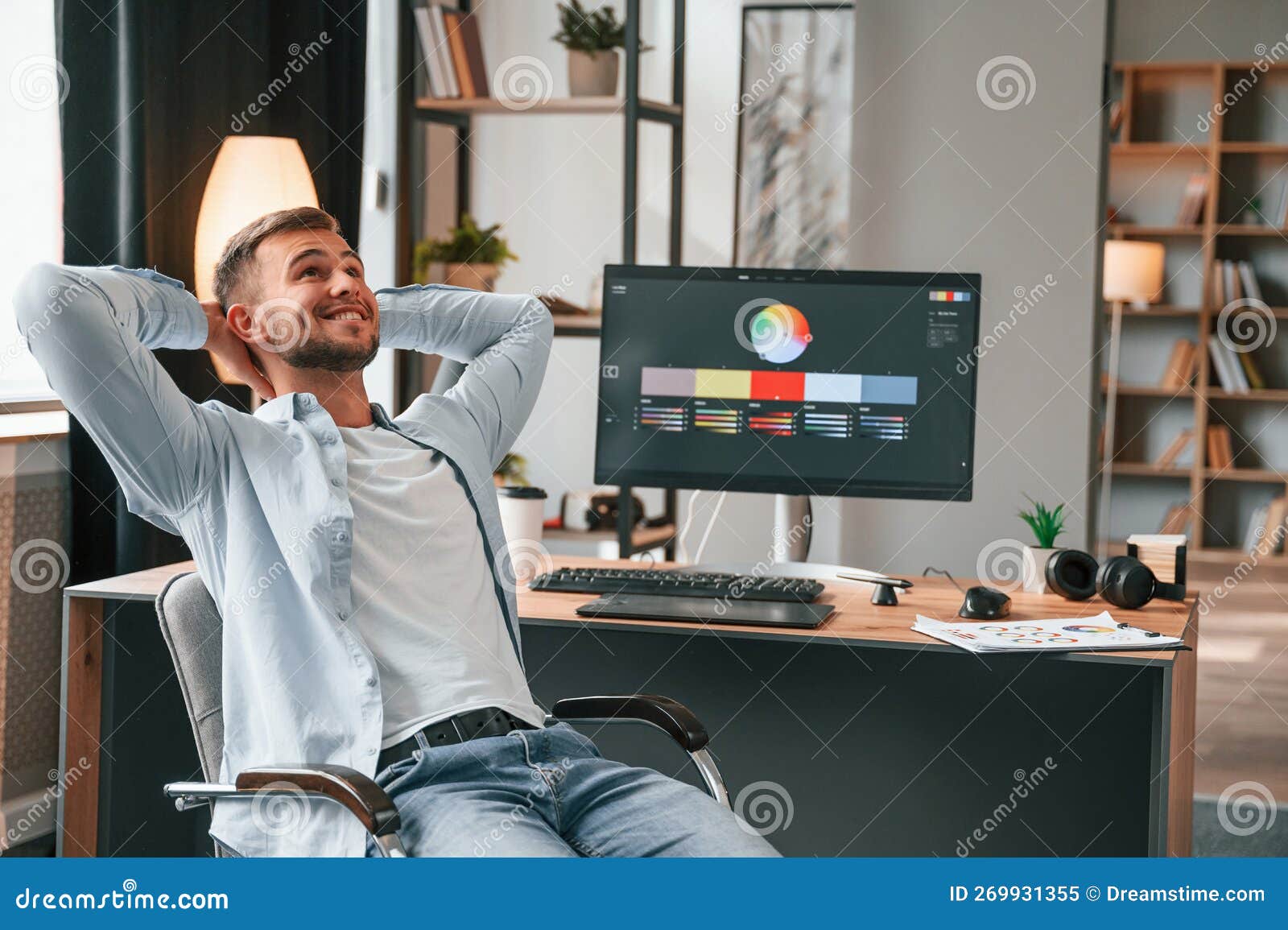 Designer is Sitting by the Computer and Using Graphics Tablet with ...