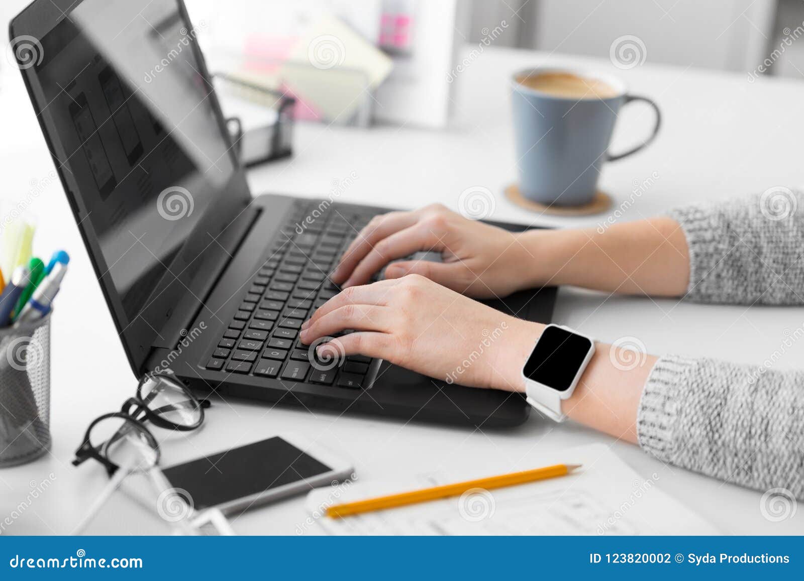 Designer with Smart Watch and Laptop at Office Stock Photo - Image of ...
