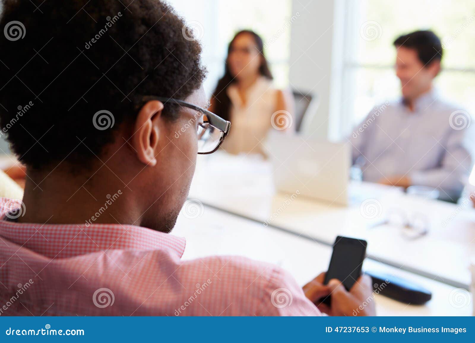 Designer Using Mobile Phone during Meeting Stock Image - Image of ...