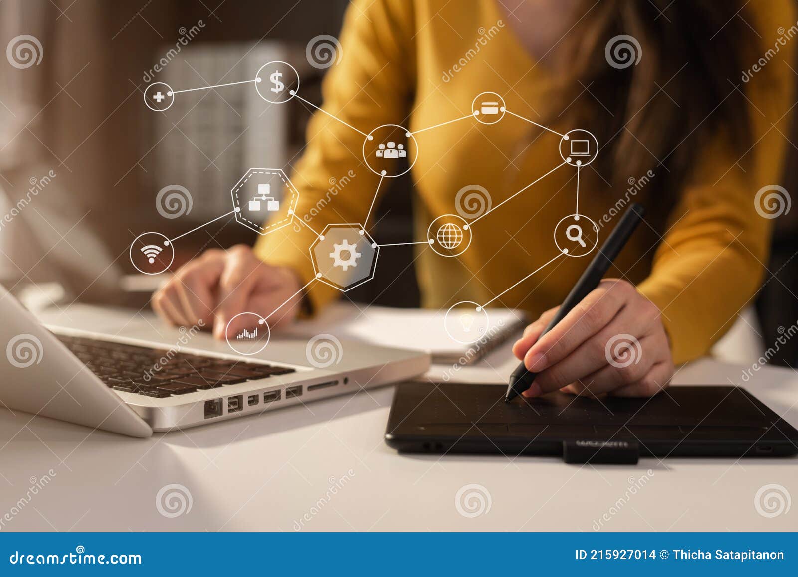 Designer Using Tablet with Laptop and Document on Desk in Modern Office ...