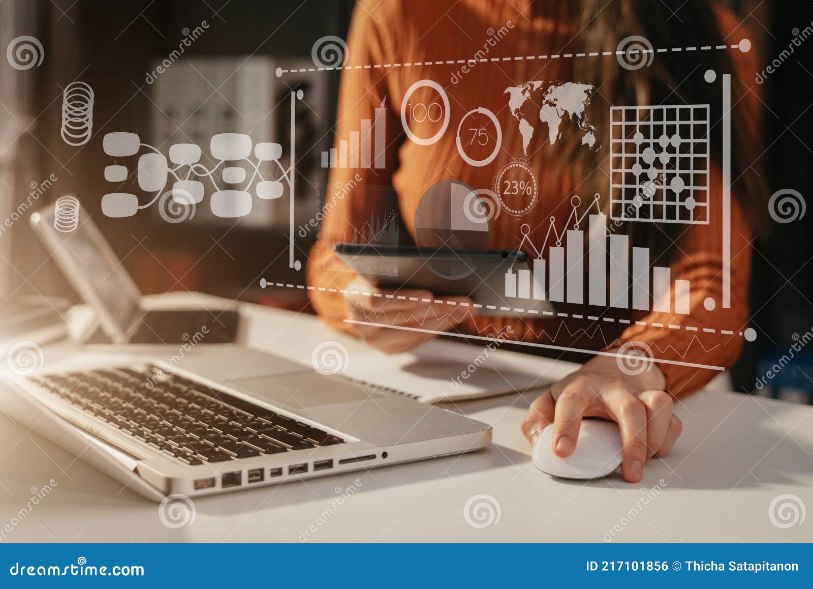 Designer Using Tablet with Laptop and Document on Desk in Office with ...