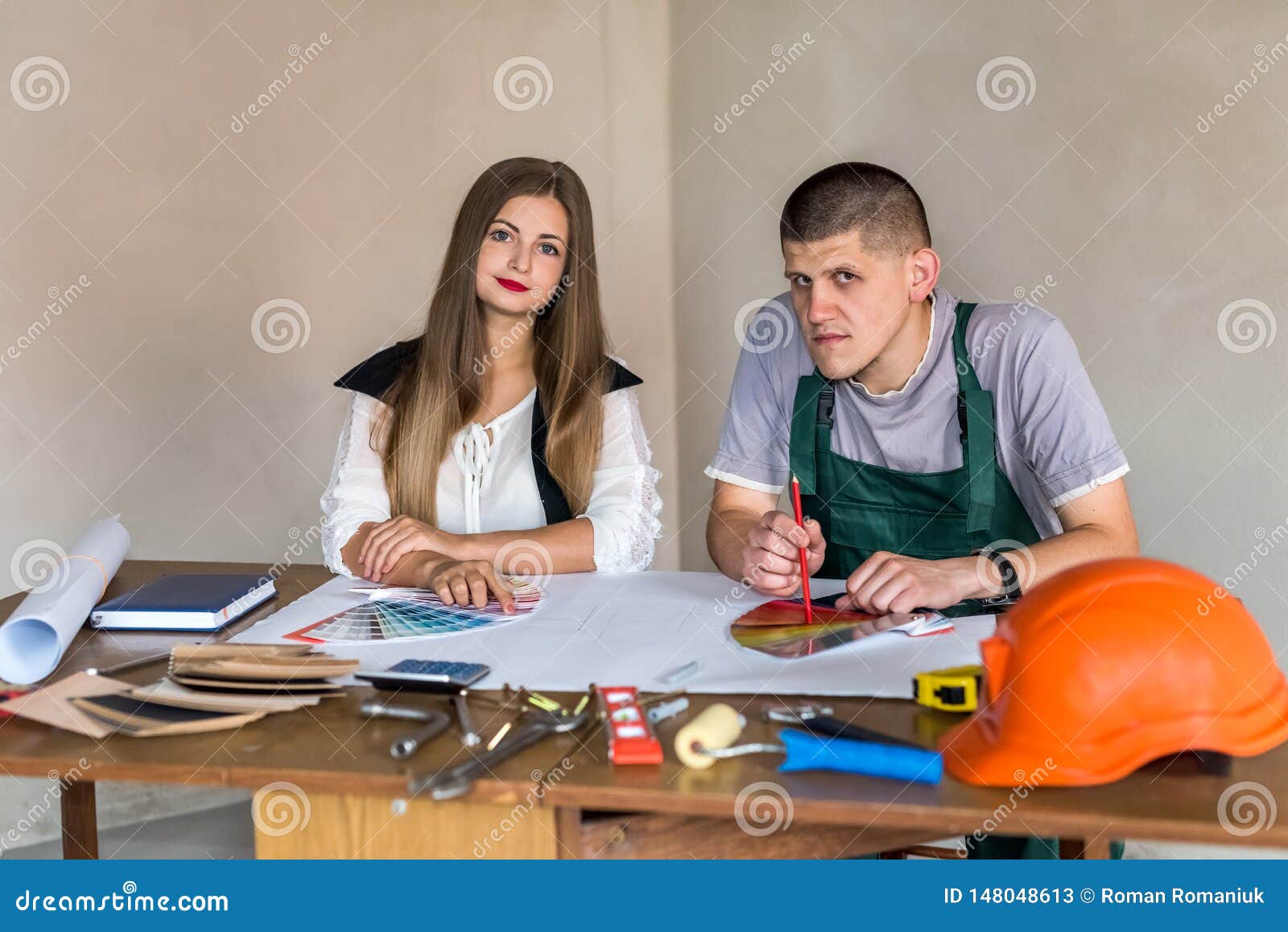 Designer and Worker Discussing Colour Scheme for New Project Stock ...