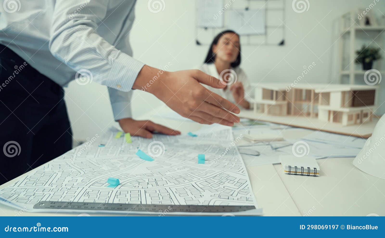 Designer Working while Discussing with Engineer about House Plan ...