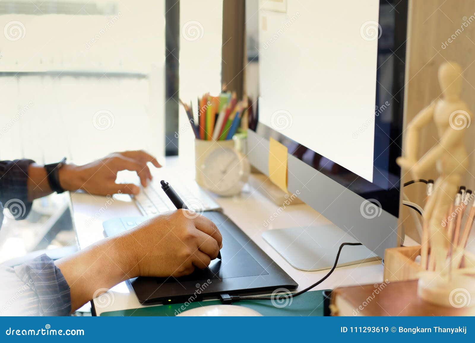 Designer Working and Writing with Notebook, Desktop Computer at Desk ...