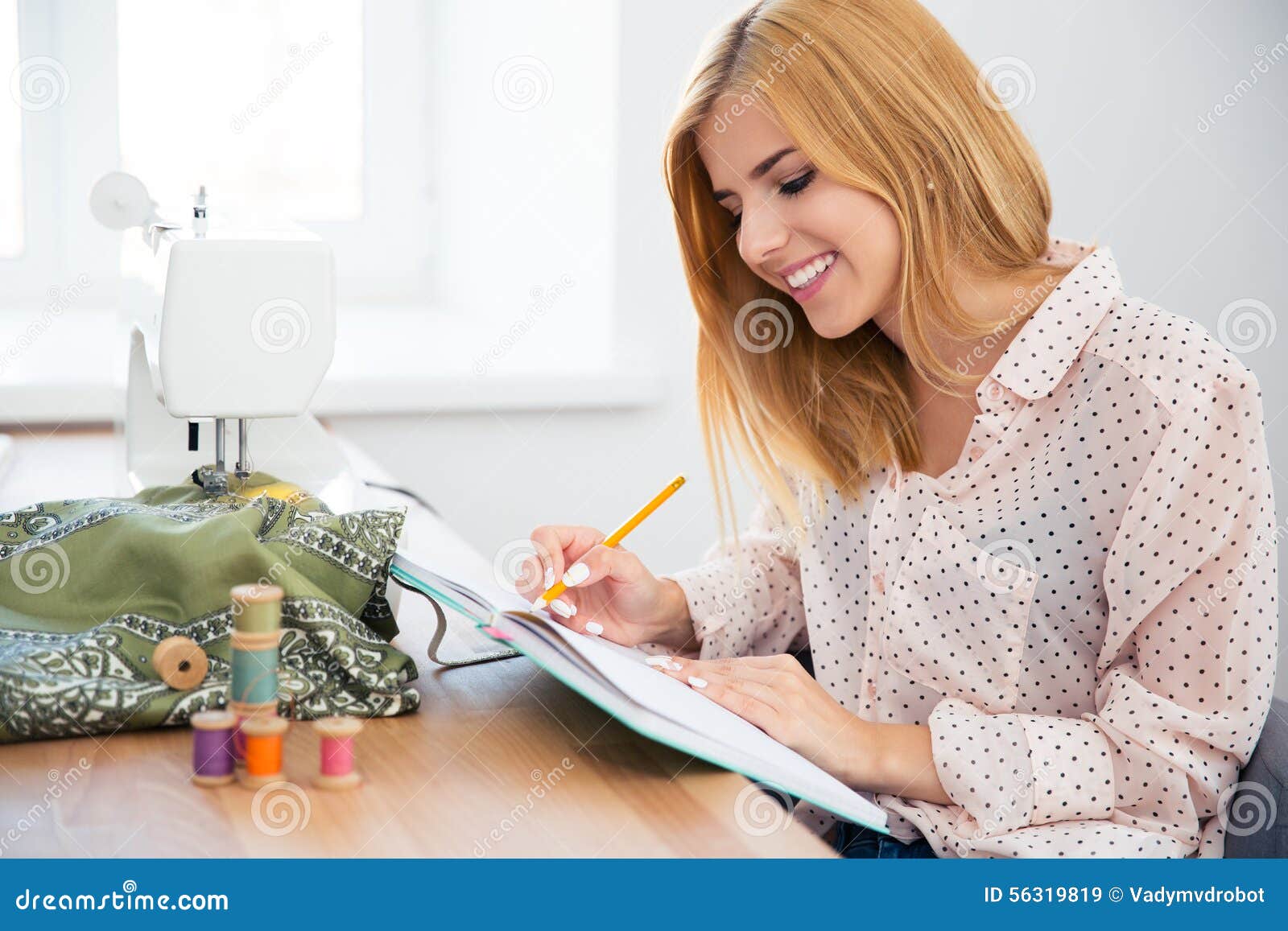 Designer writing notes stock image. Image of sewing, sitting - 56319819
