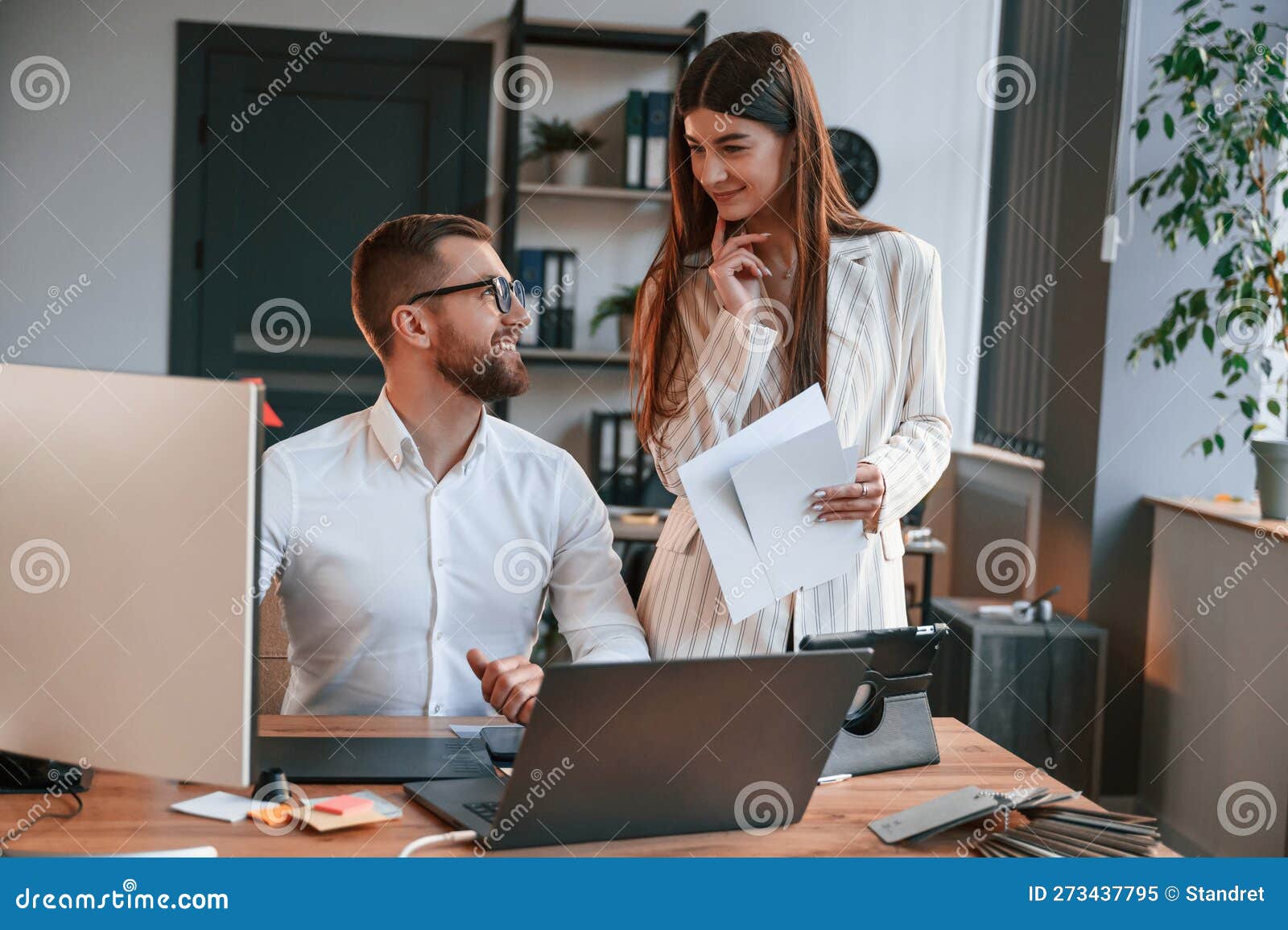 Designers are Talking and Working. Two Employees are Together in the ...