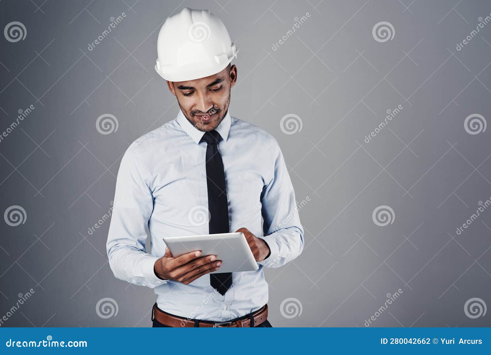 Designing Made Easy. a Well-dressed Civil Engineer Using His Tablet ...