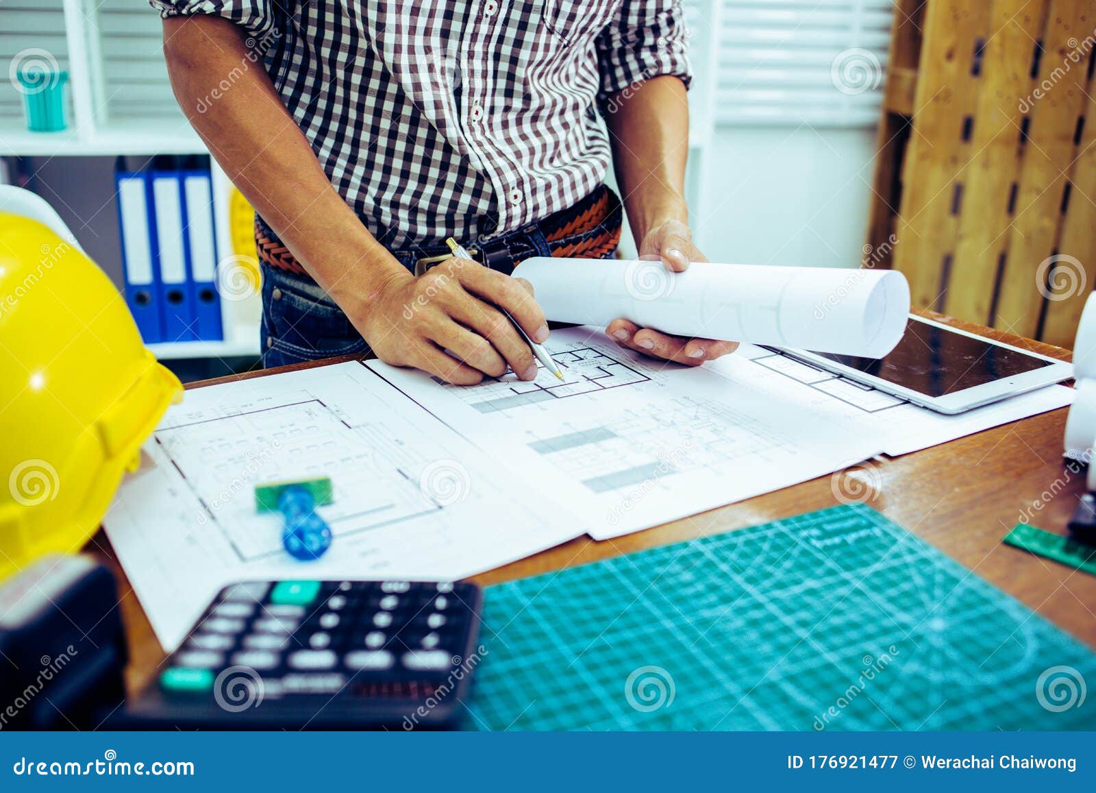 Desk of Architectural Working Project in Construction Site,with Drawing ...