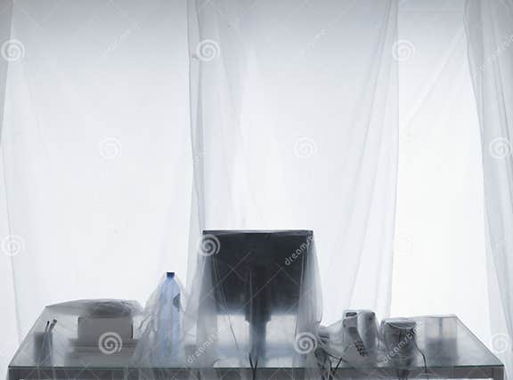 Desk and Computer Covered in Transparent Dust Sheets Stock Image ...
