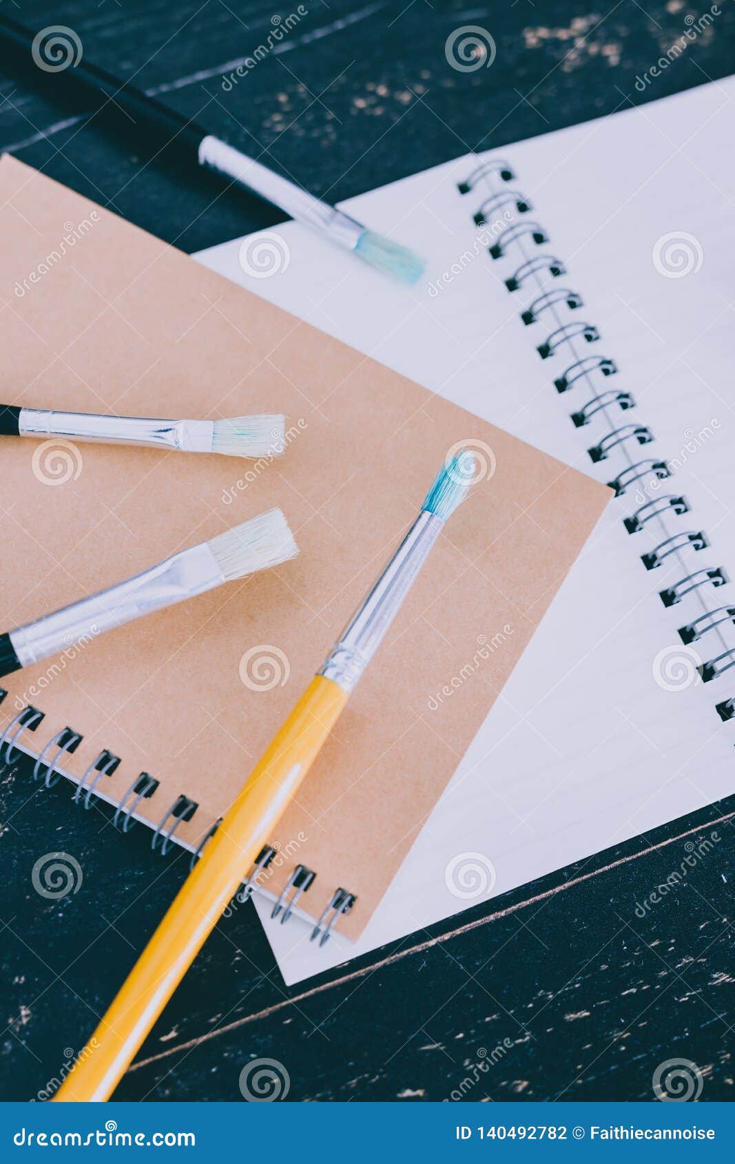 Desk with Notepads and Watercolour Brushes with Empty Pages and ...