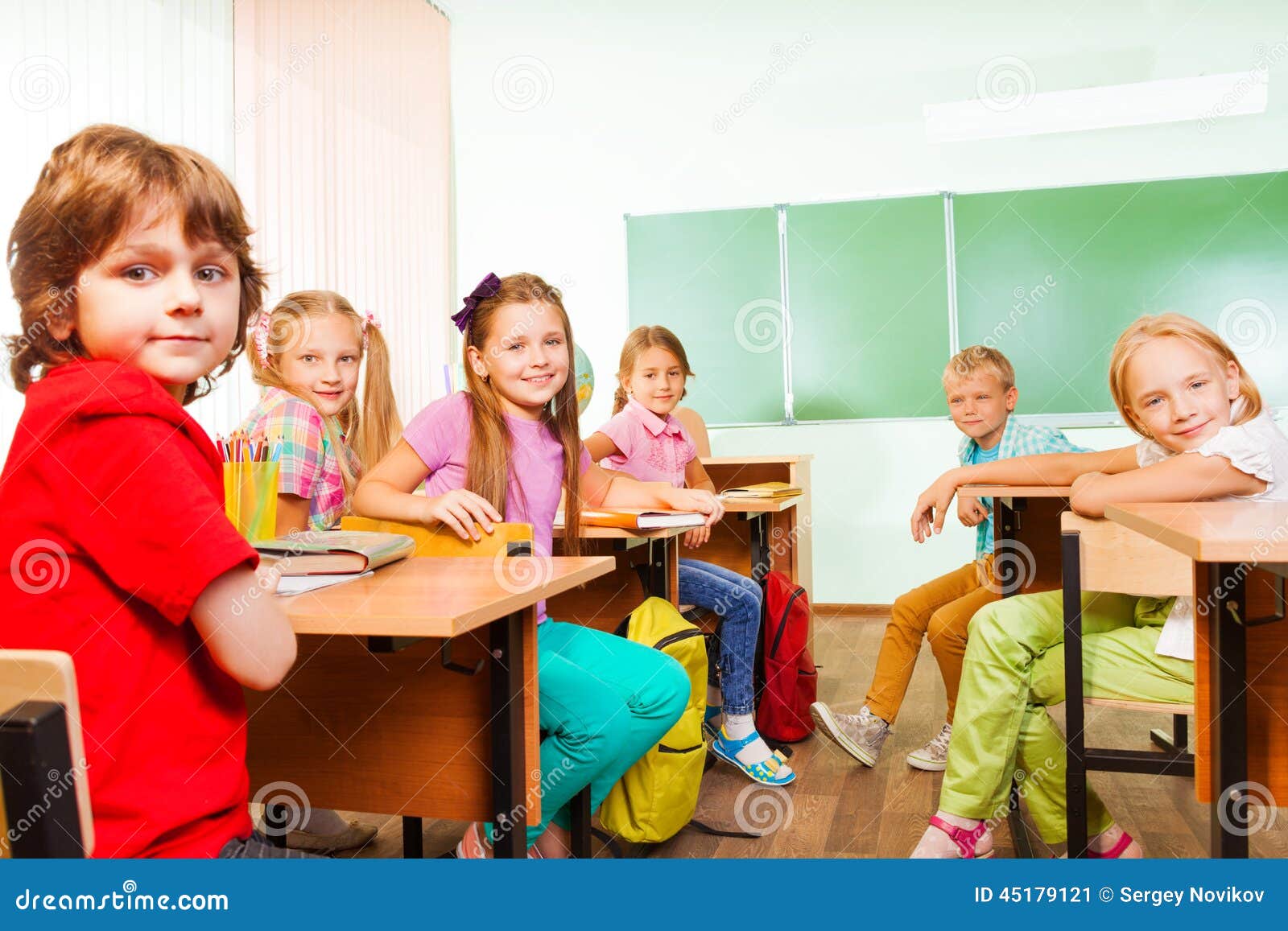 Desk Rows with Children Looking Straight Stock Image - Image of group ...