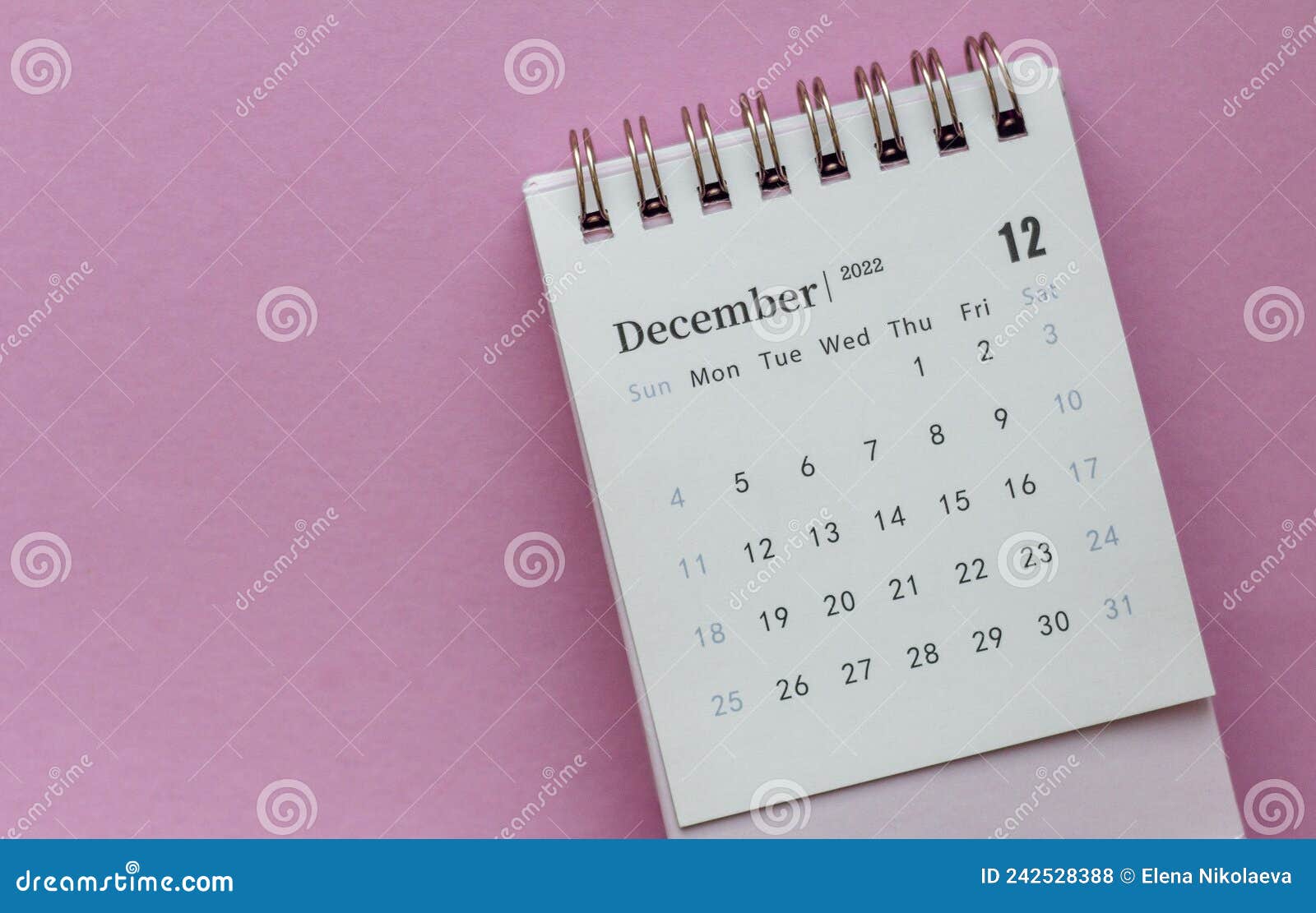 Desktop Calendar for December 2022 on a Pink Background. Stock Photo ...